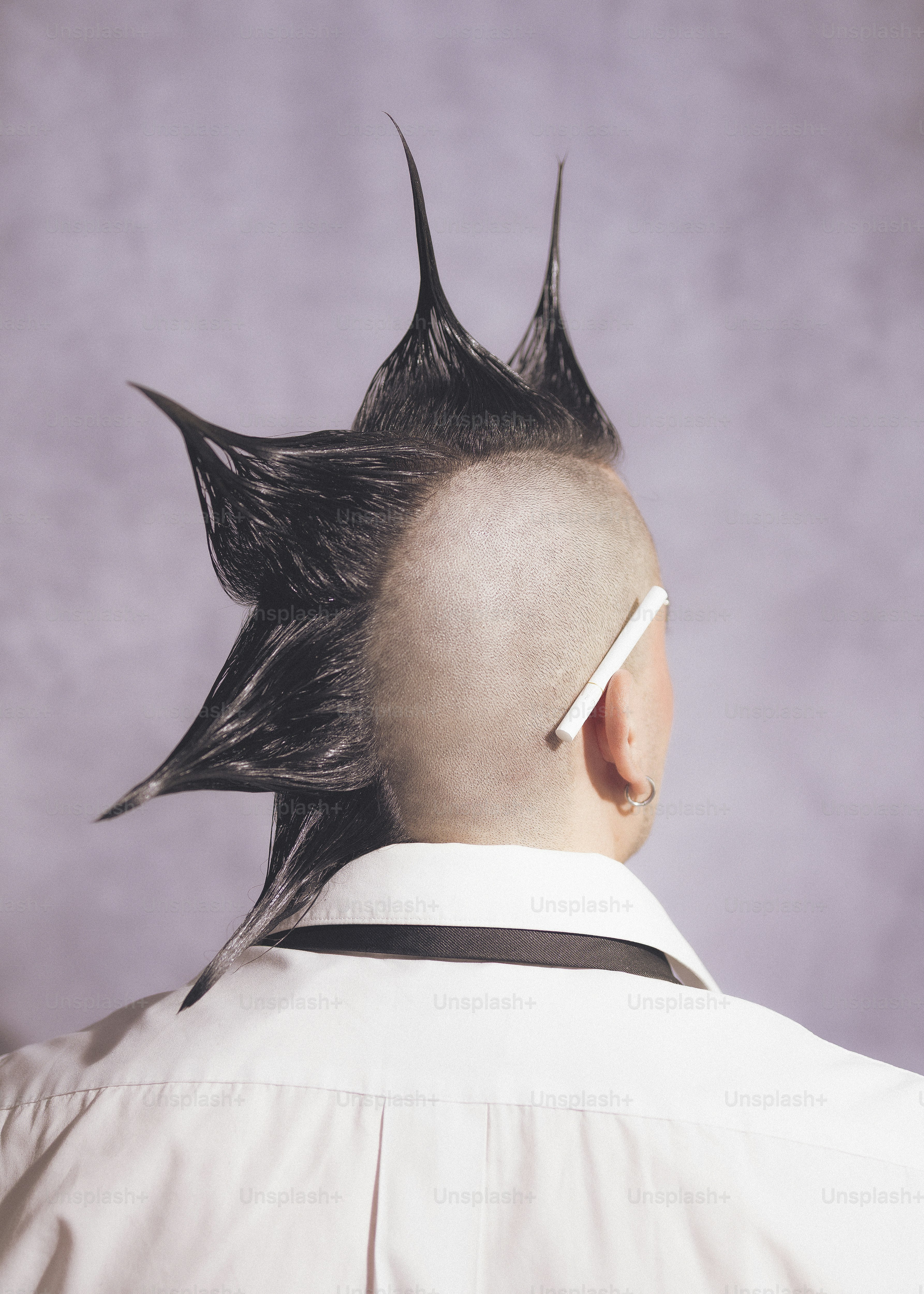A person with a spiky mohawk hairstyle. photo – Portrait Image on Unsplash