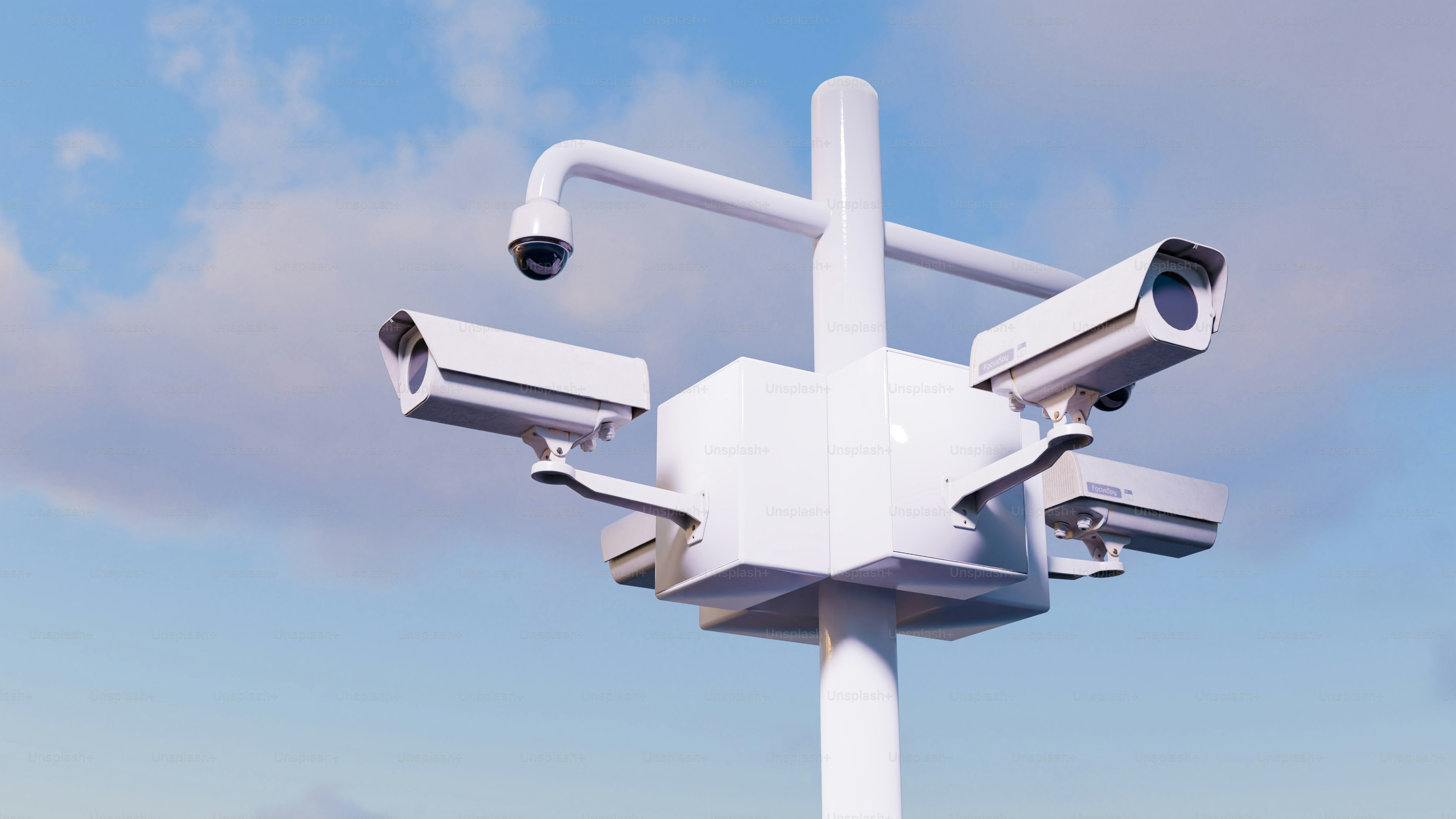 A man monitors security cameras in a control room. photo – Security ...