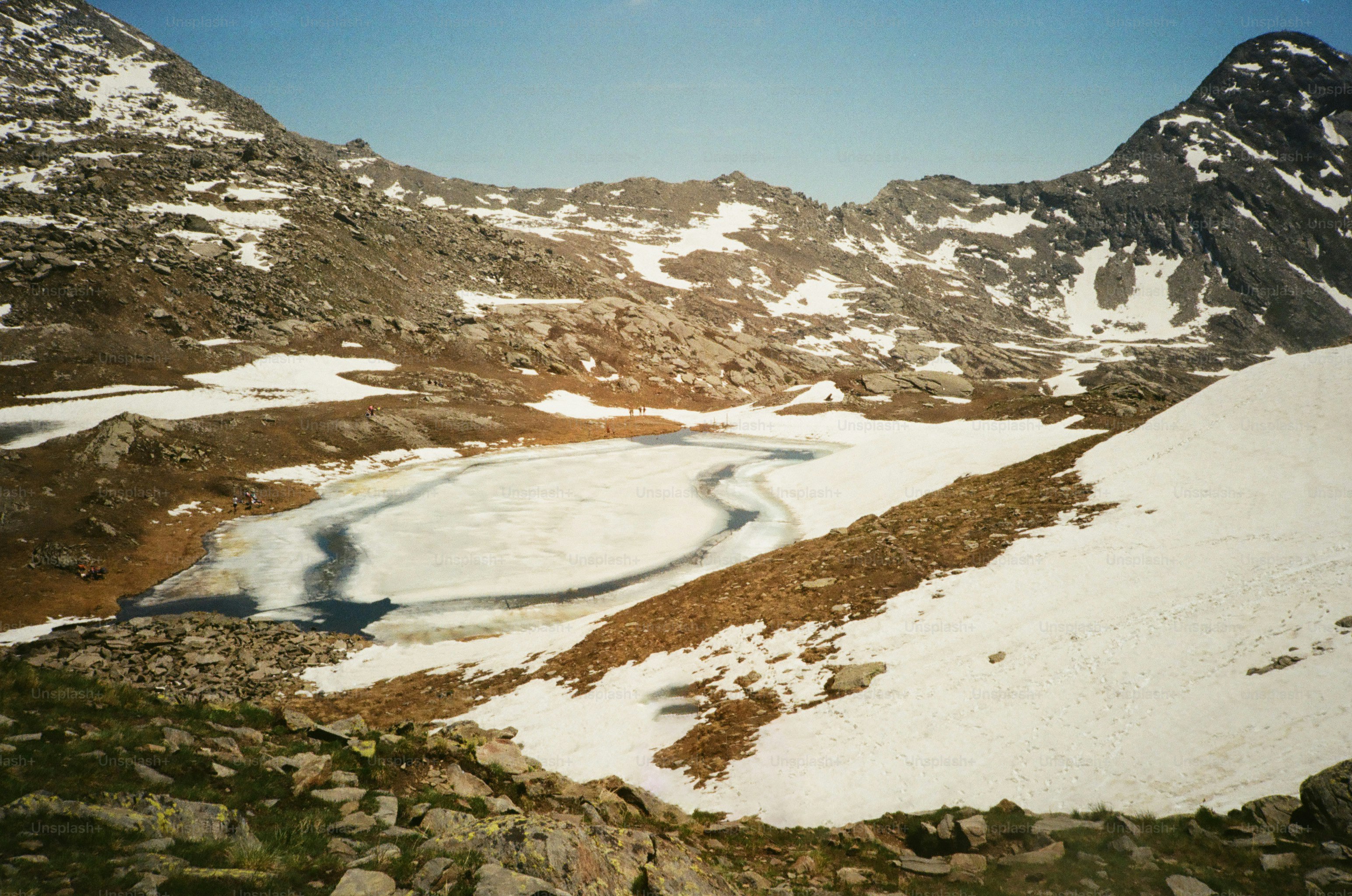 Mountain landscape with a partially frozen lake. photo – Snow Image on ...