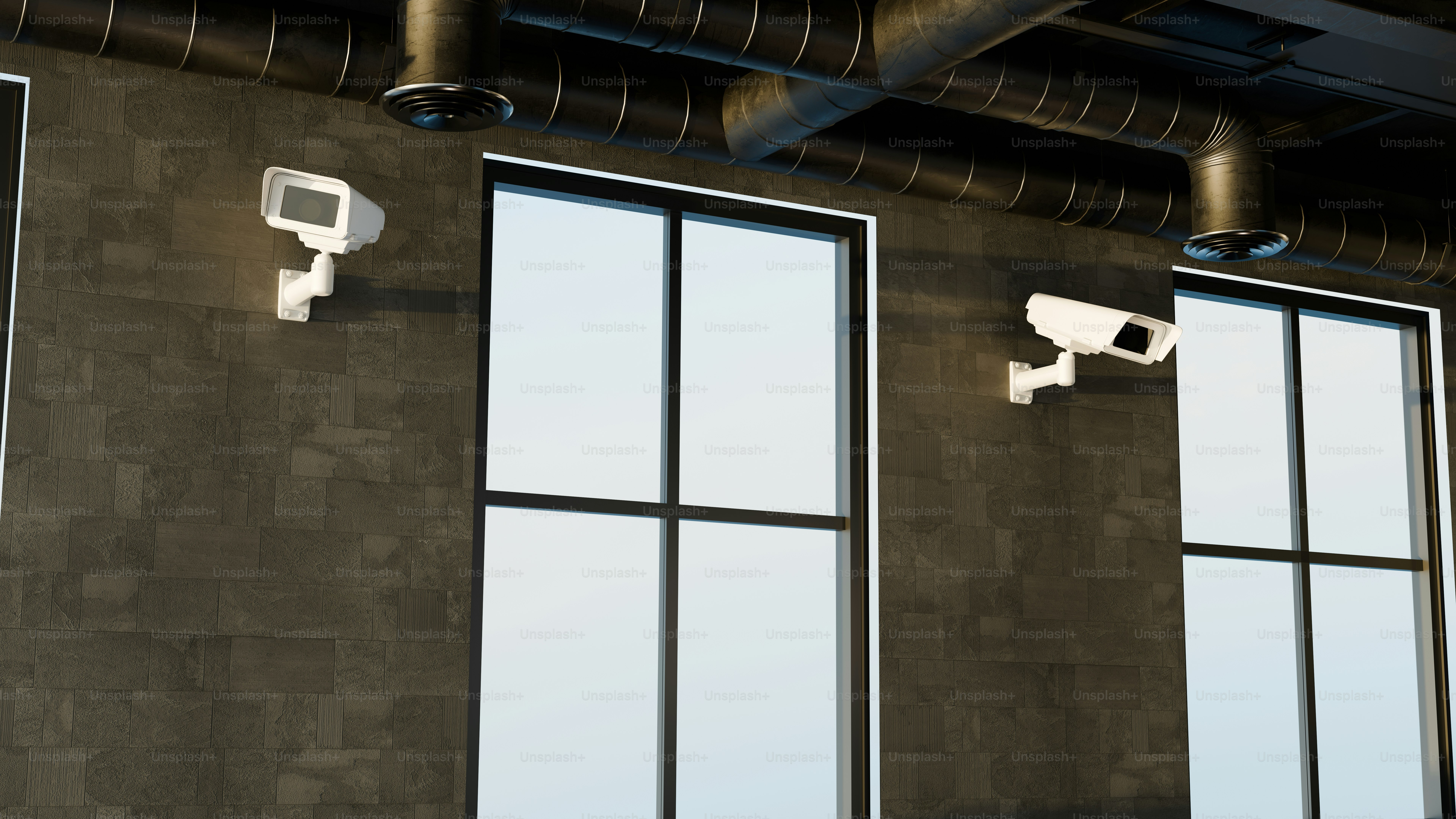 Security cameras are mounted on a wall by windows. photo – Security ...