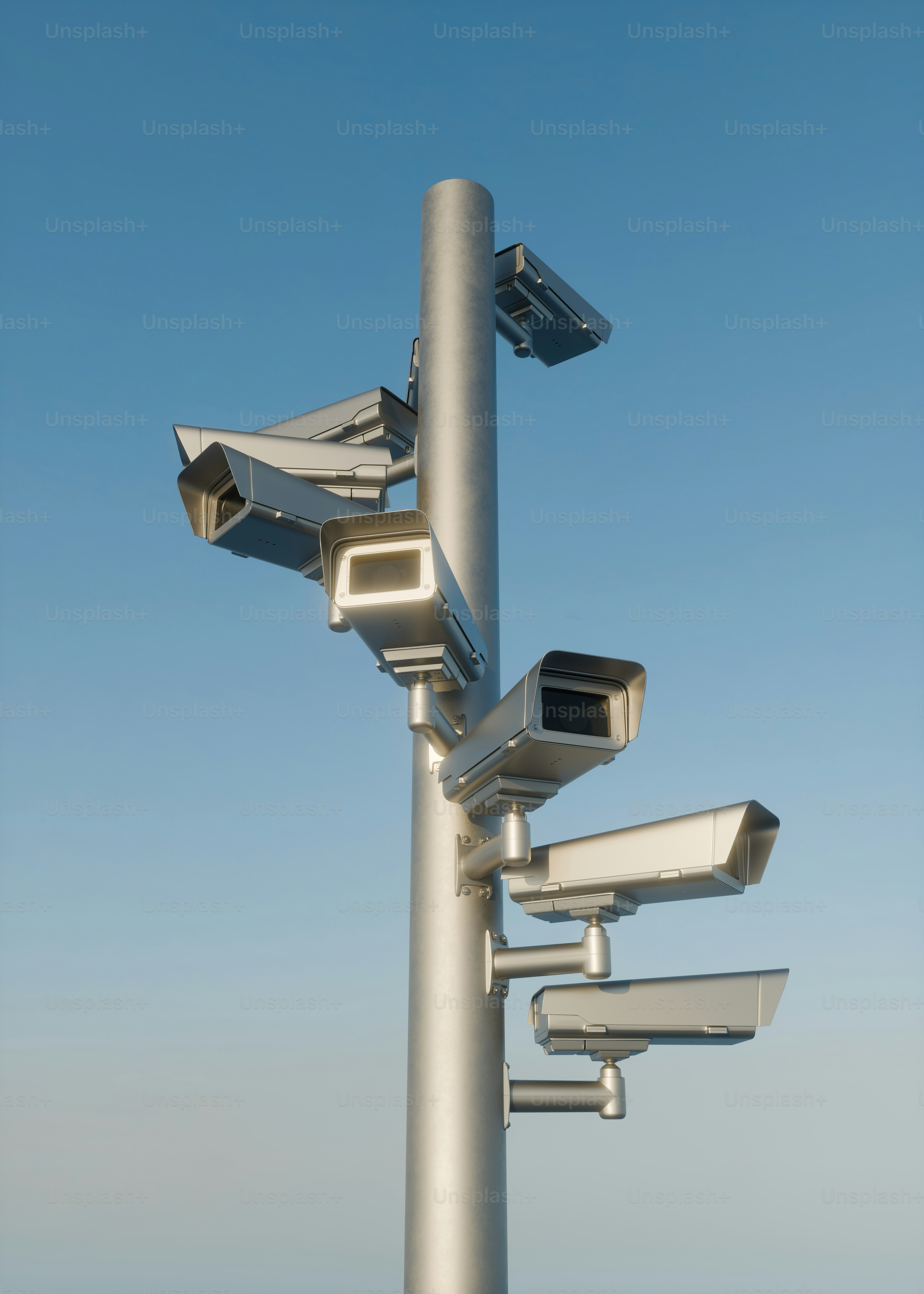 Surveillance cameras mounted on a pole monitor the area. photo ...