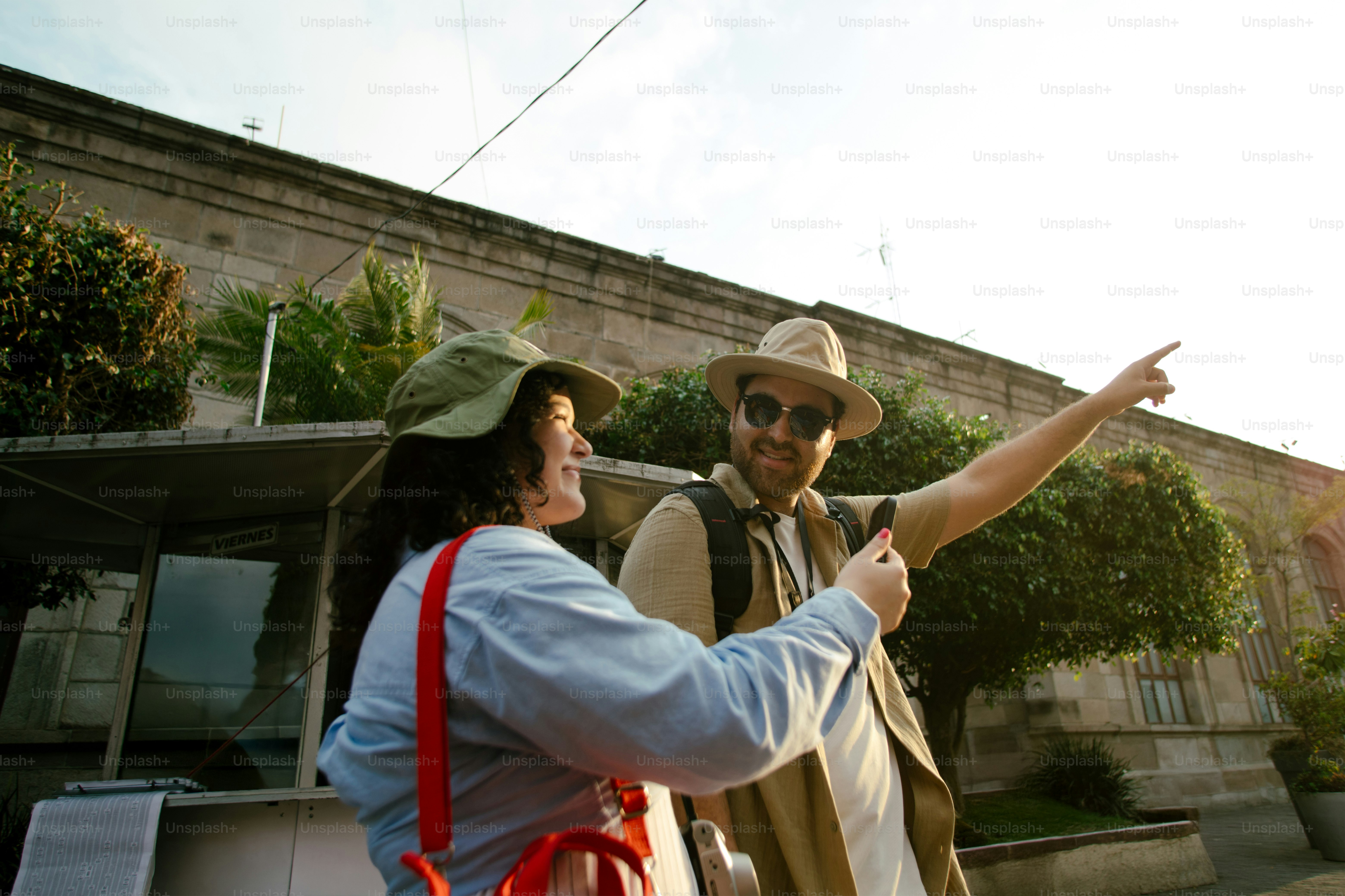 Tourists explore a city and point at something. photo – Travel Image on ...