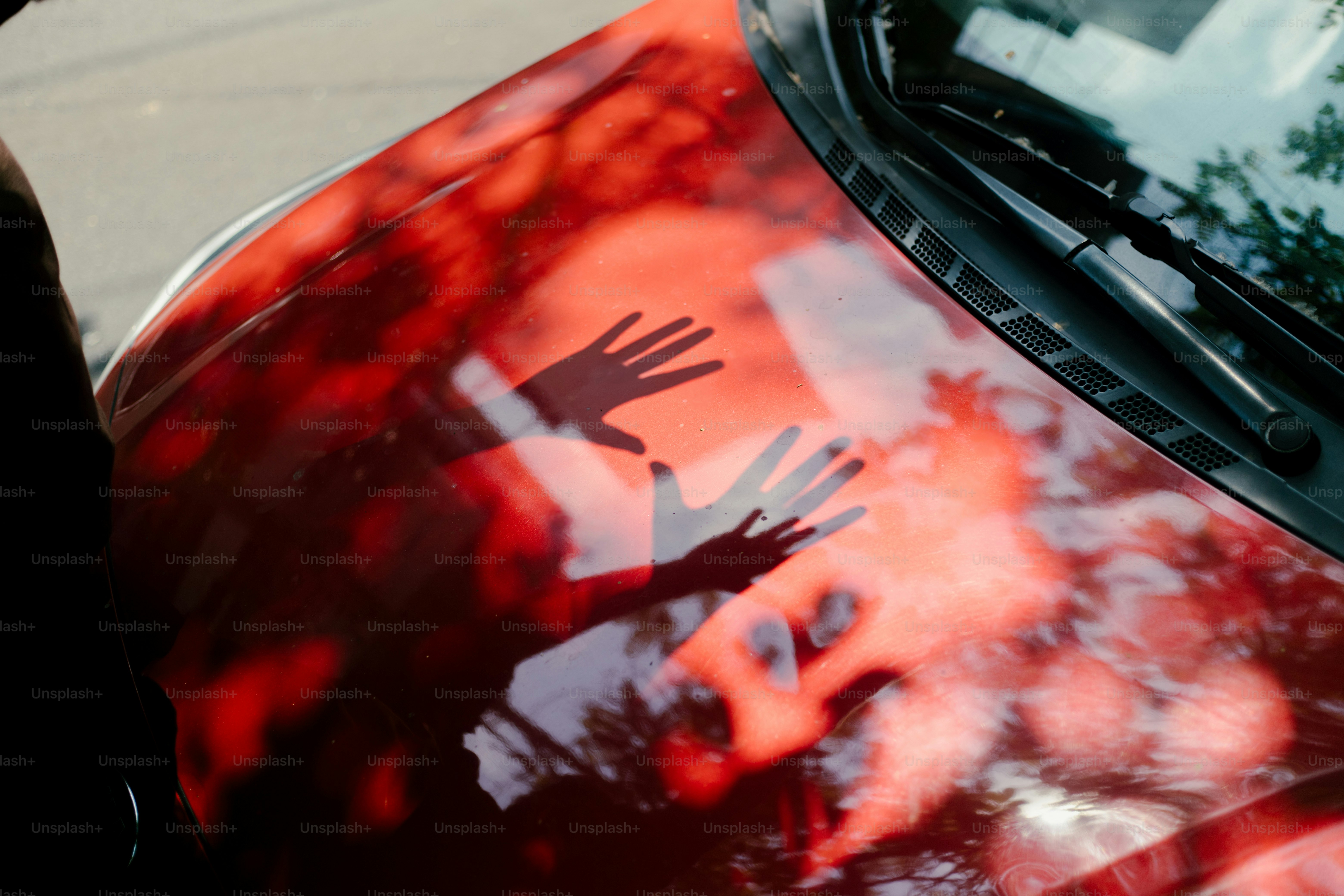 Shadows of hands are reflected on the car hood. photo – Abstract Image ...