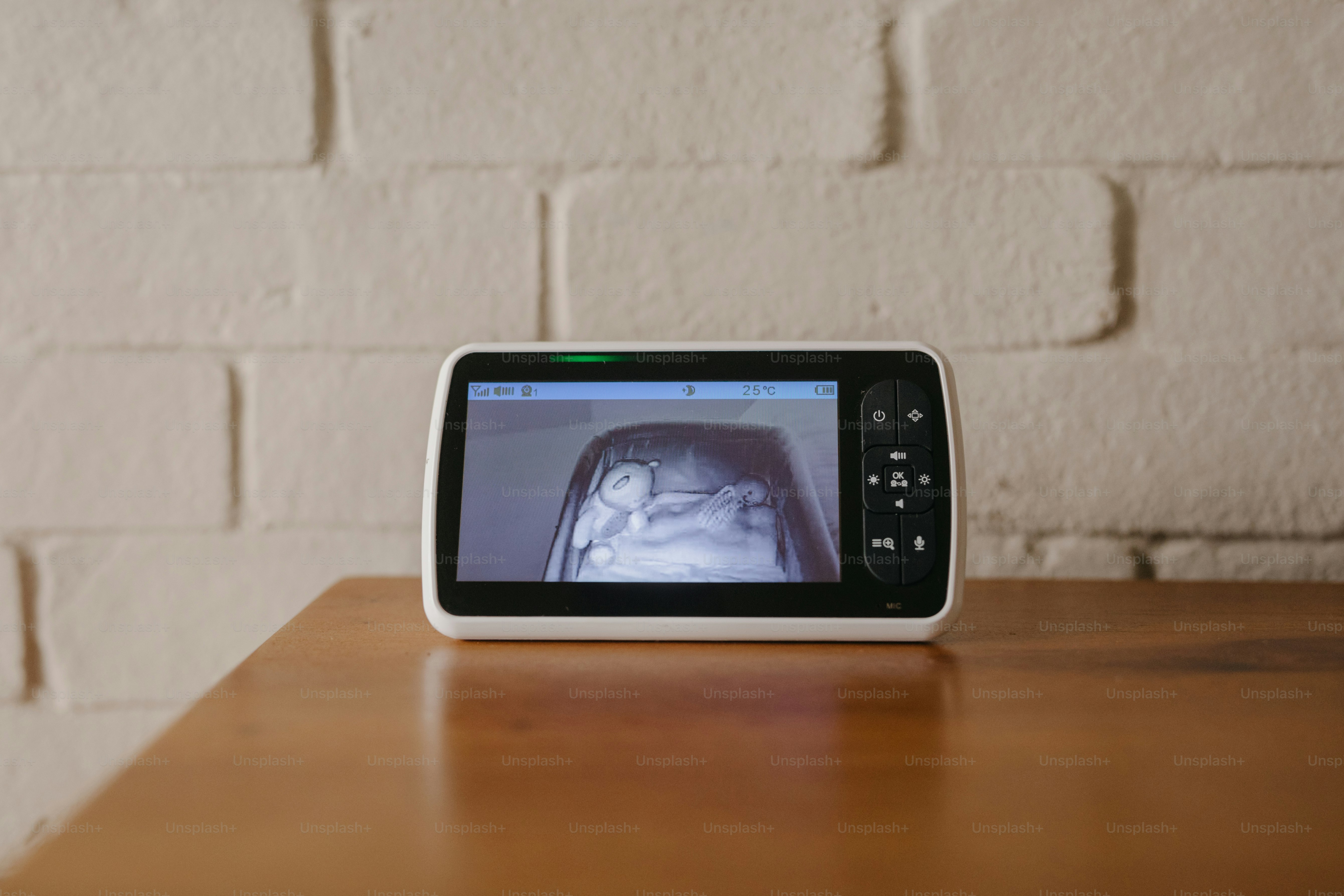 A baby monitor displays a child sleeping. photo – Technology Image on ...