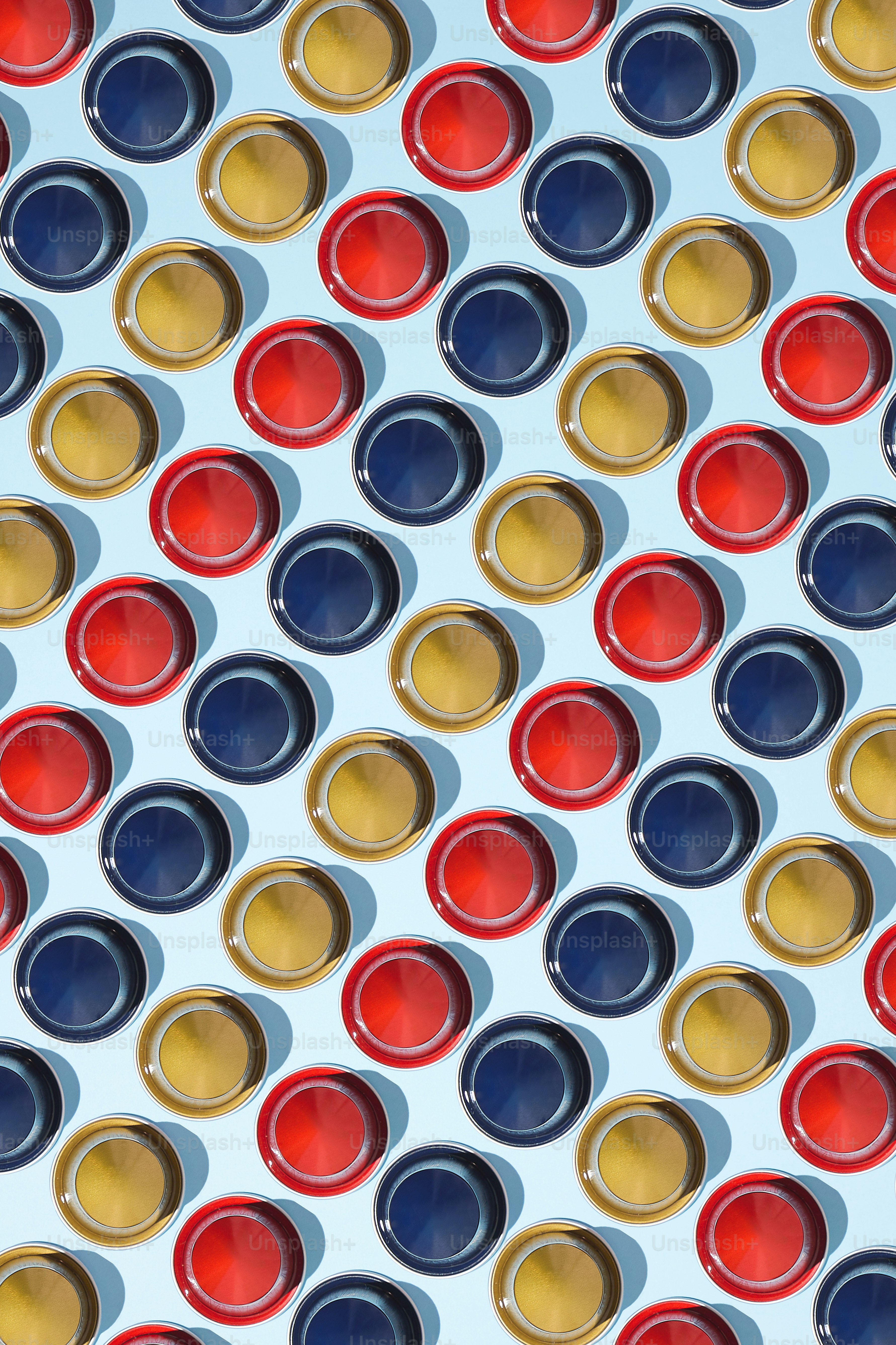 Colorful cups are neatly arranged on a light blue surface. photo – Food ...