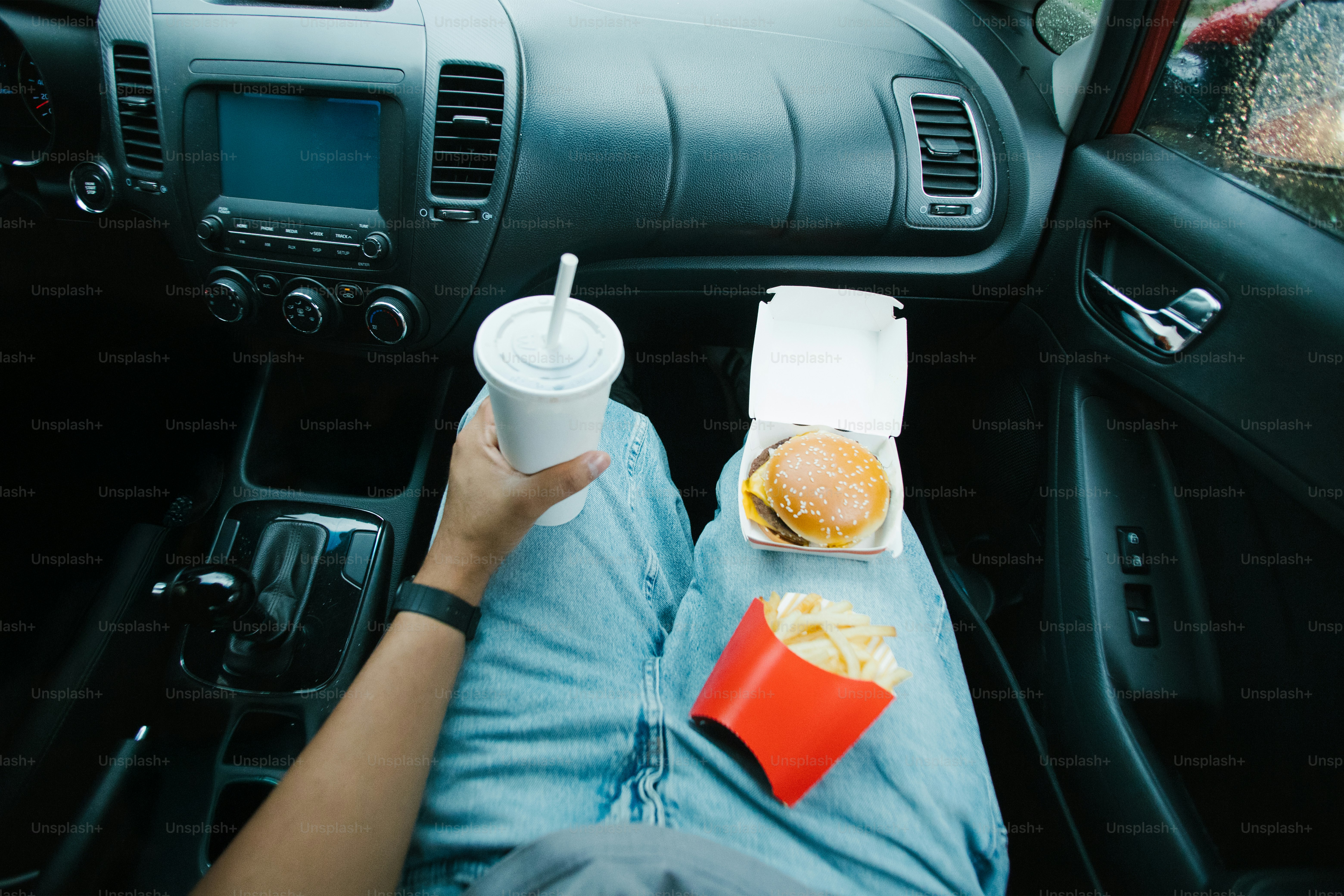 Fast food being enjoyed in a car. photo – Car Image on Unsplash