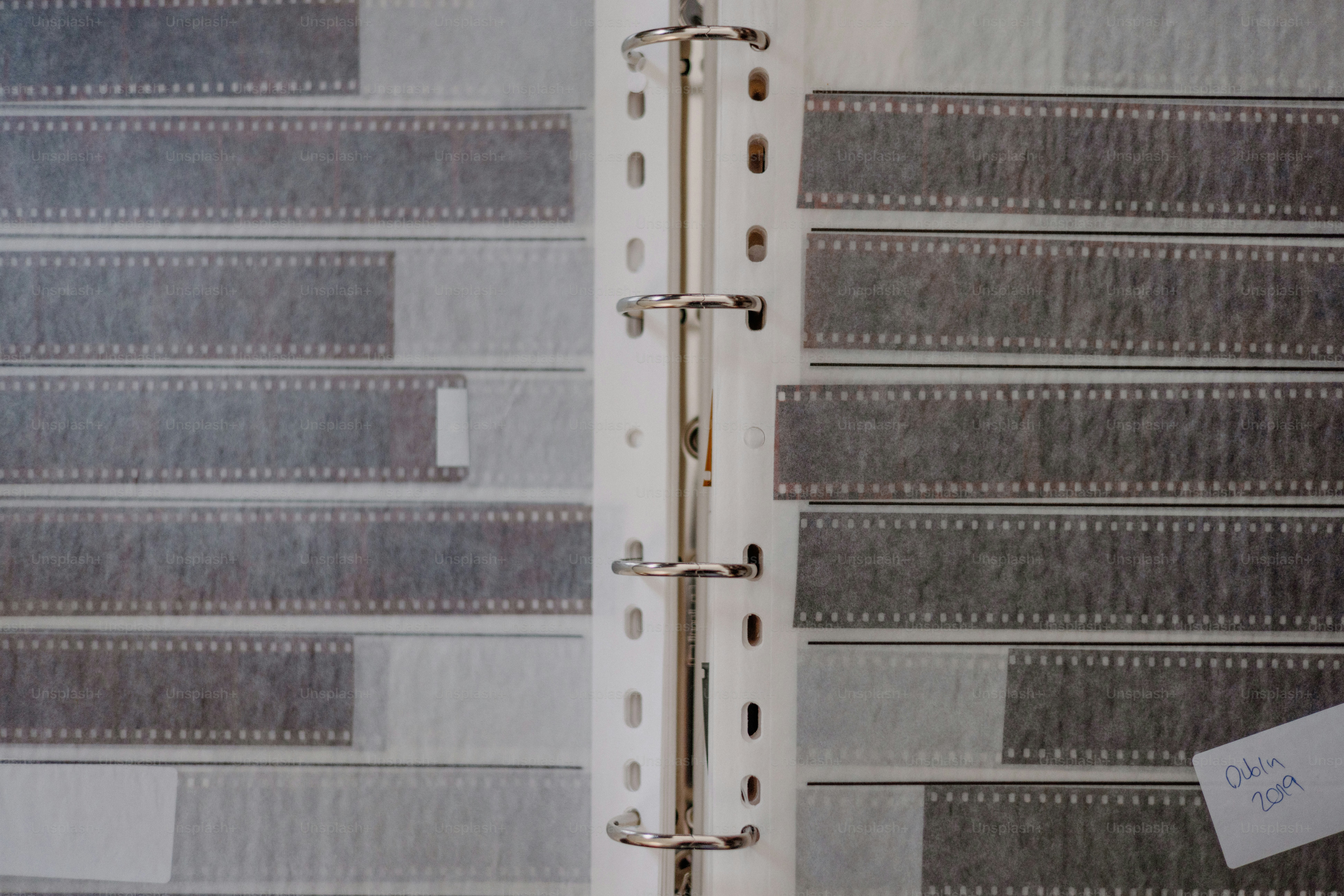 Film negatives are displayed in a photo album. photo – Photography ...