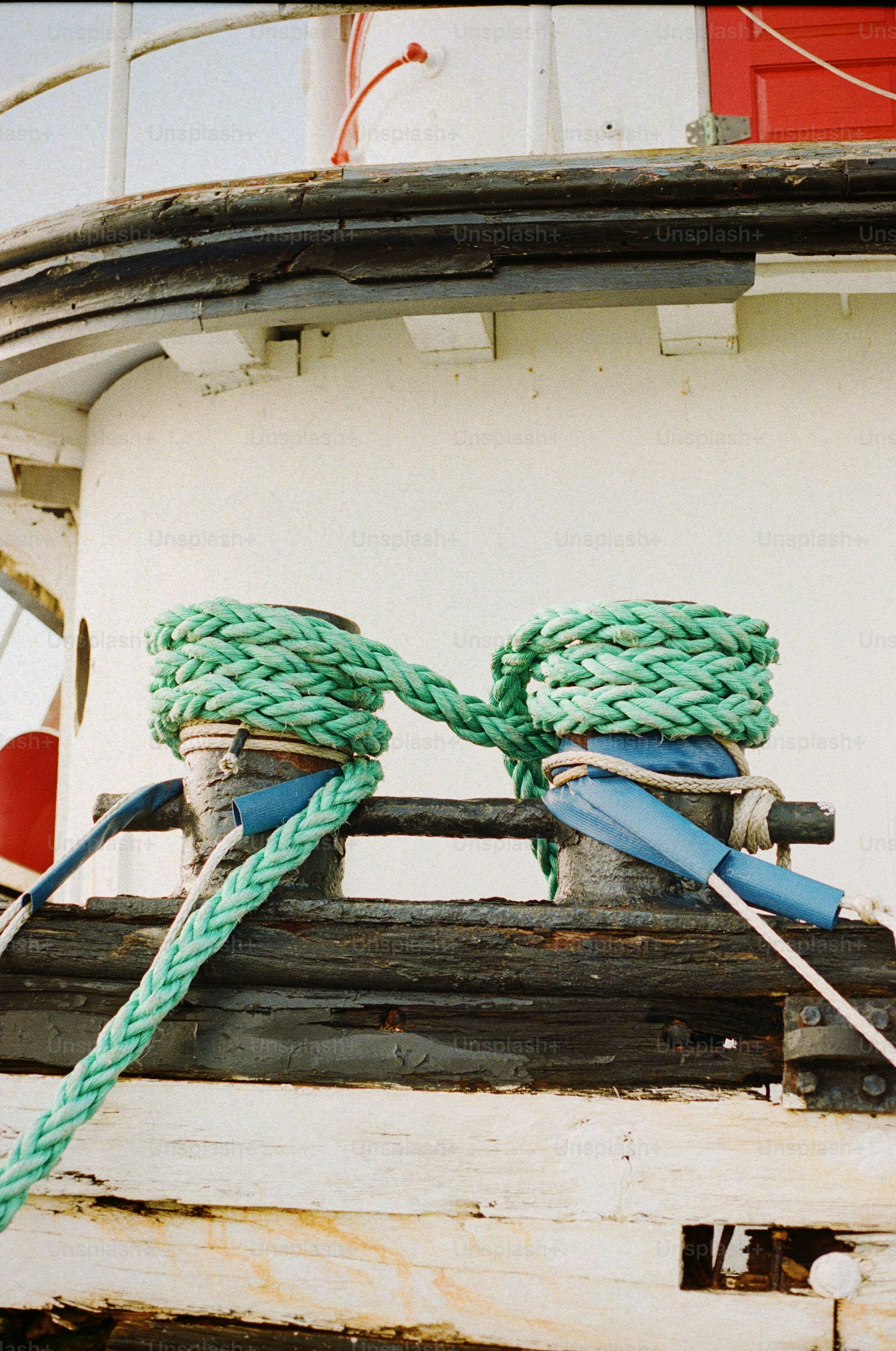 Ropes are wrapped around the bollards of a boat. photo – Ship Image on ...