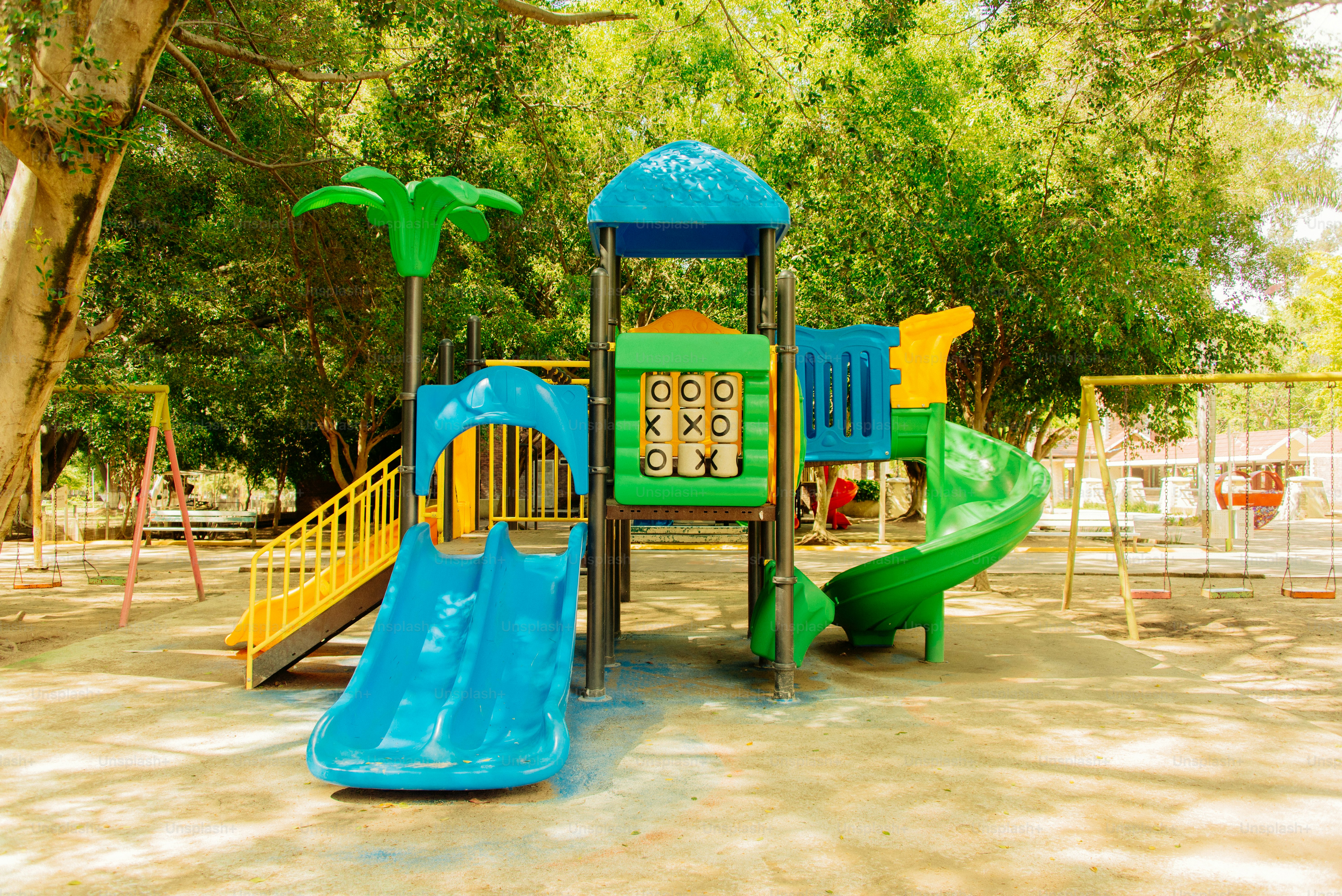 Colorful playground equipment is ready for play. photo – Blue Image on ...