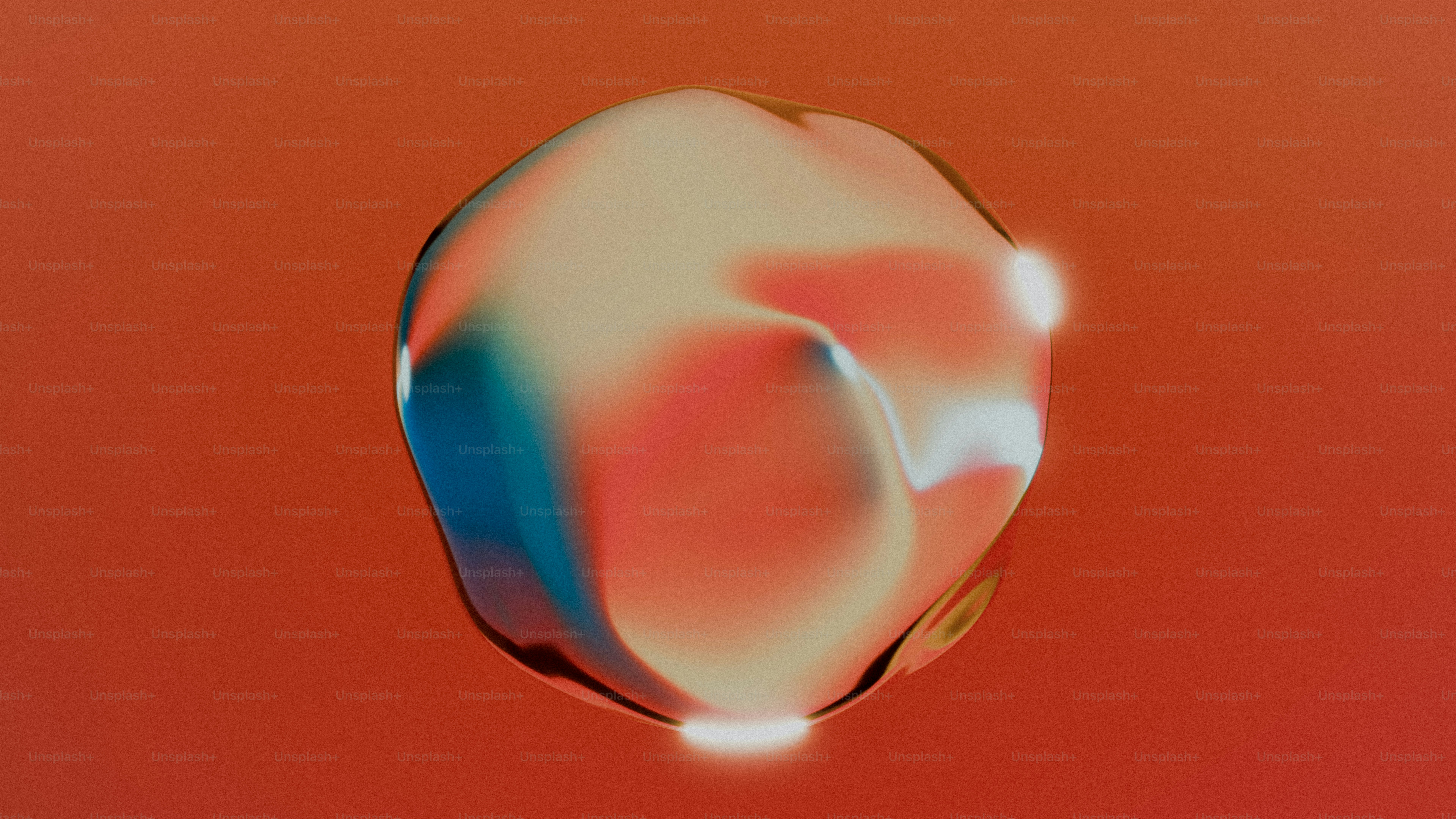 A blob-shaped object floats against a red background. photo – Wallpaper ...