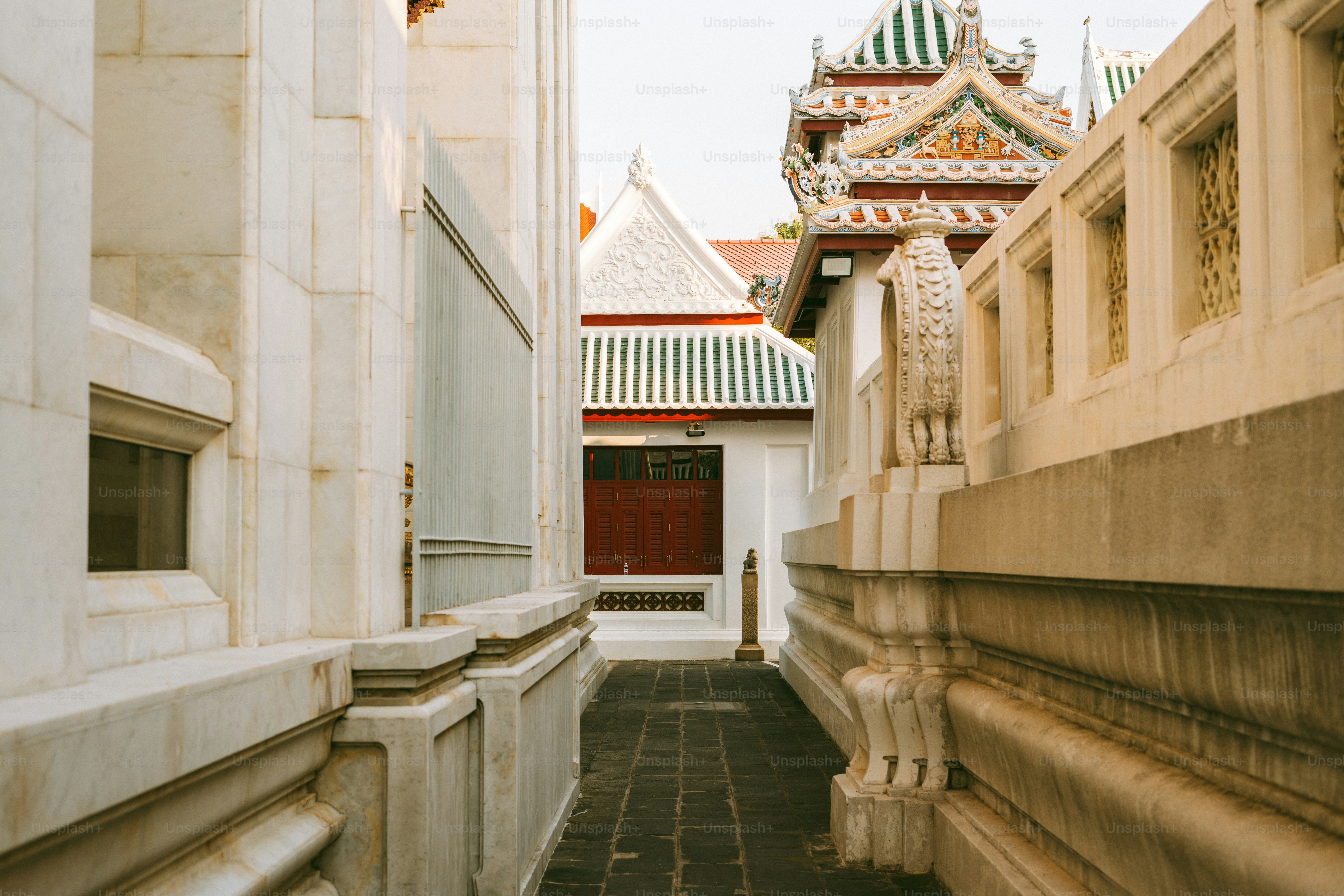 A narrow alleyway leads to a beautiful temple. photo – Travel Image on ...