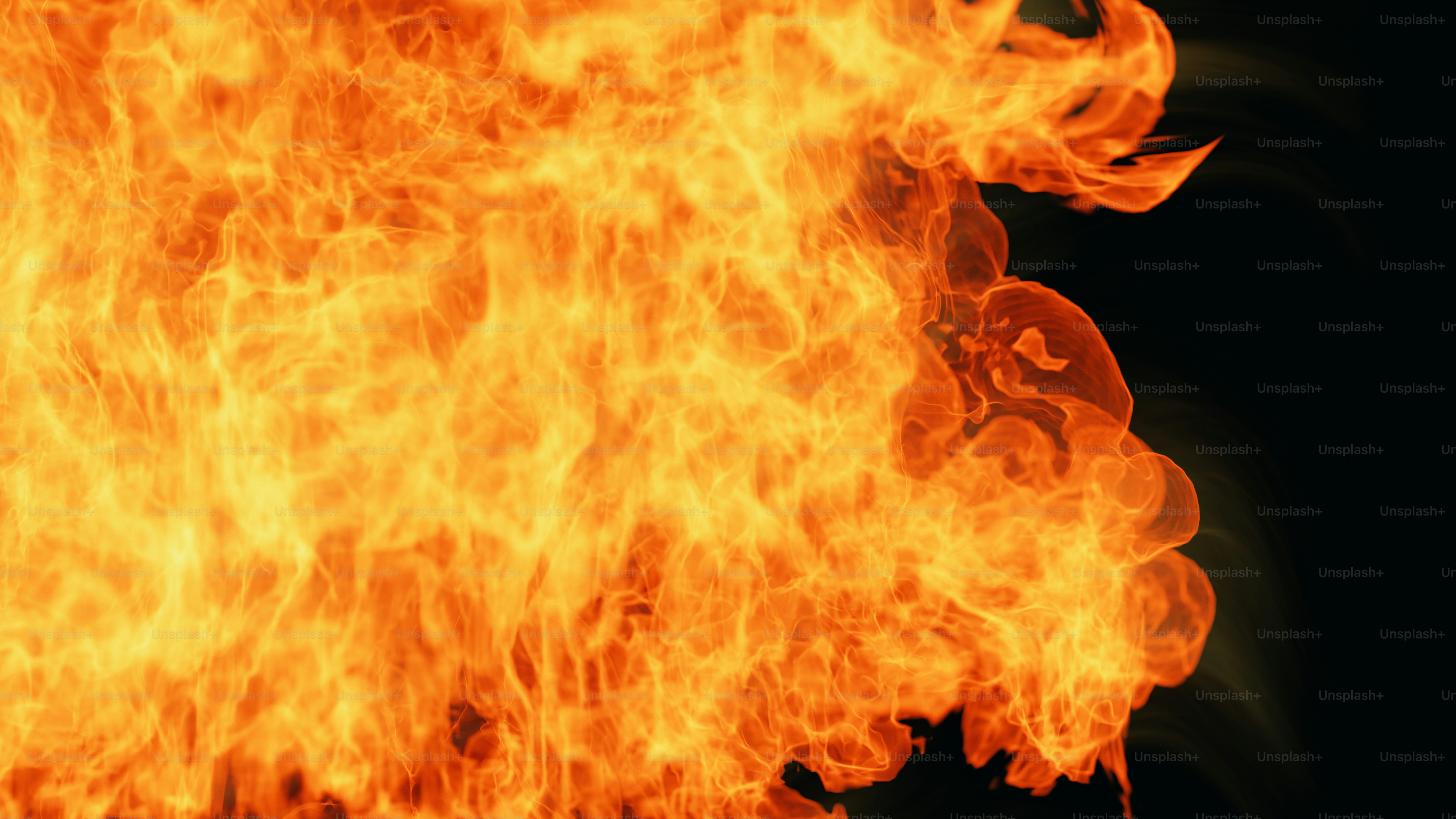 Intense flames erupt against a black background. photo – Render Image ...