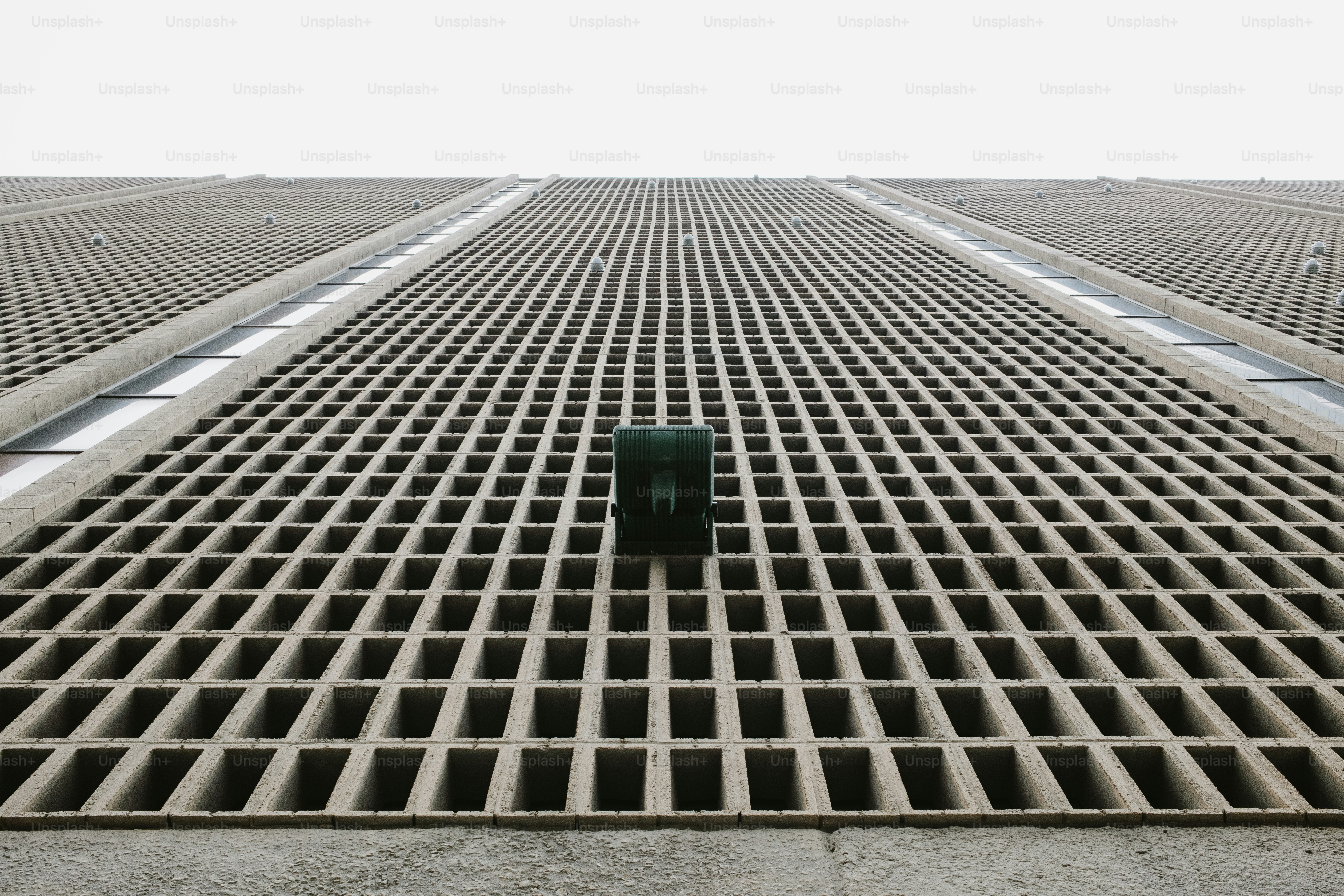 A high-rise building with a grid facade. photo – Architecture Image on ...