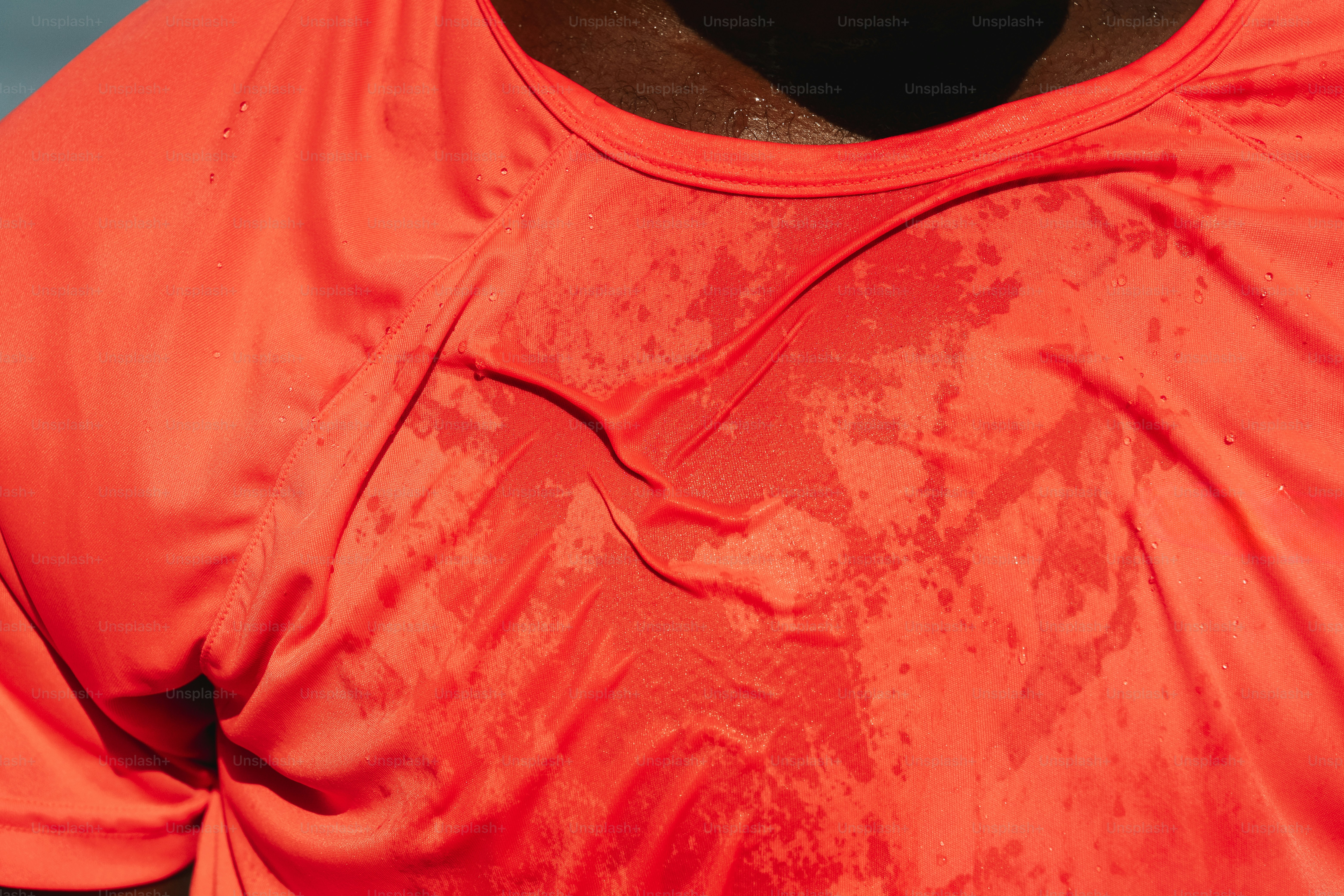 A man, sweating, rubs his face. photo – Summer Image on Unsplash