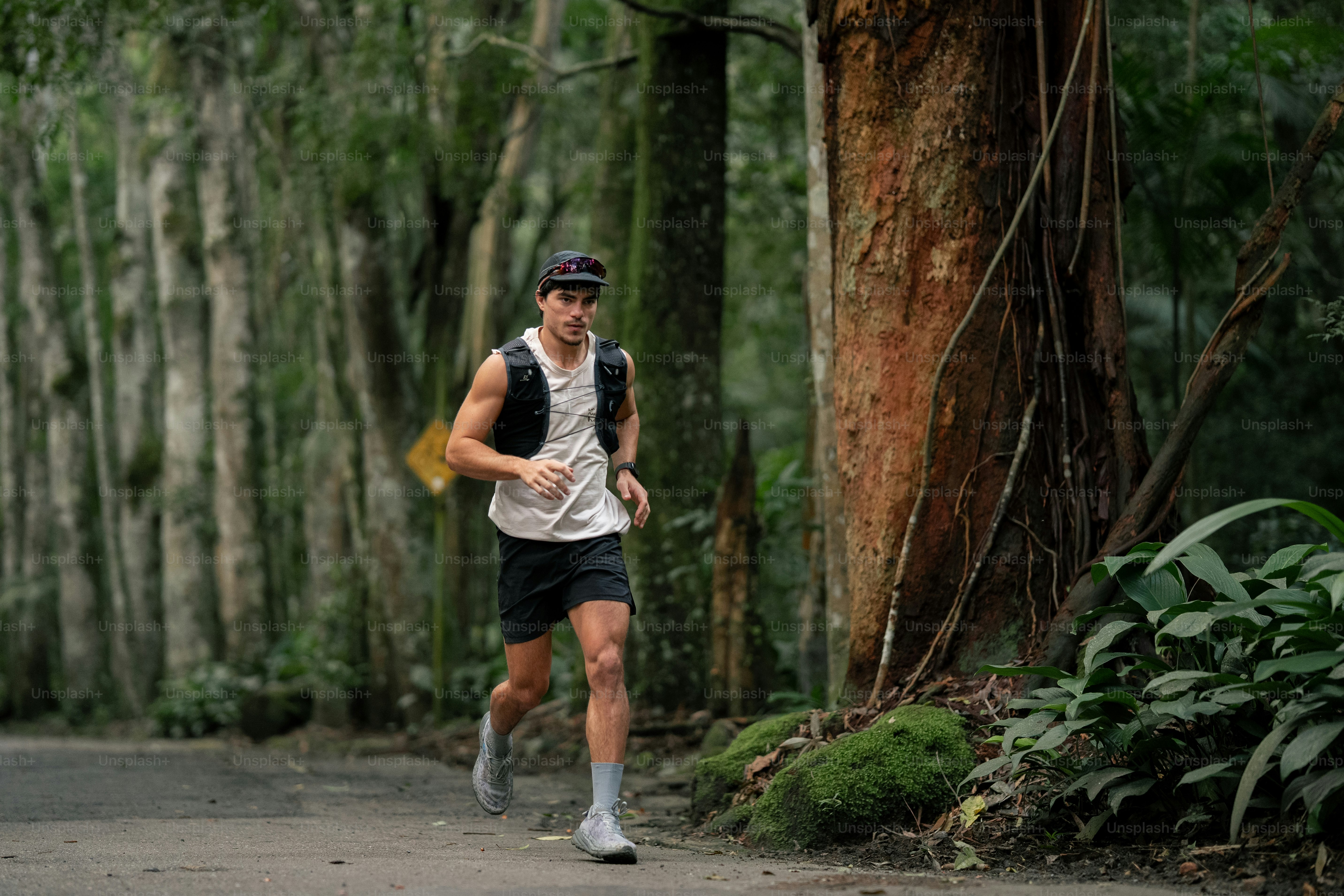 Man runs through a forest trail. photo – Sport Image on Unsplash