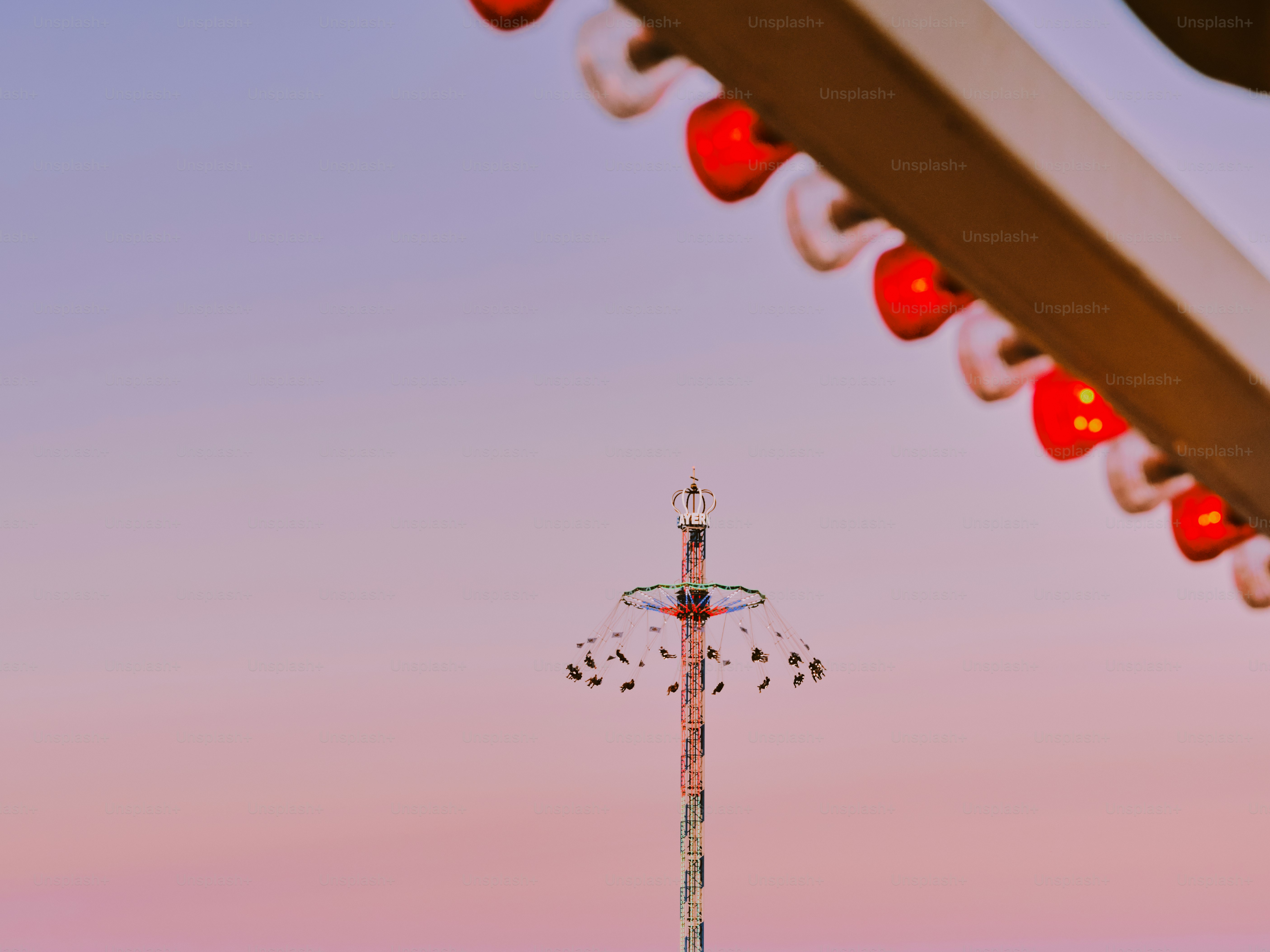 Fairground ride against a beautiful sunset sky. photo – Film ...