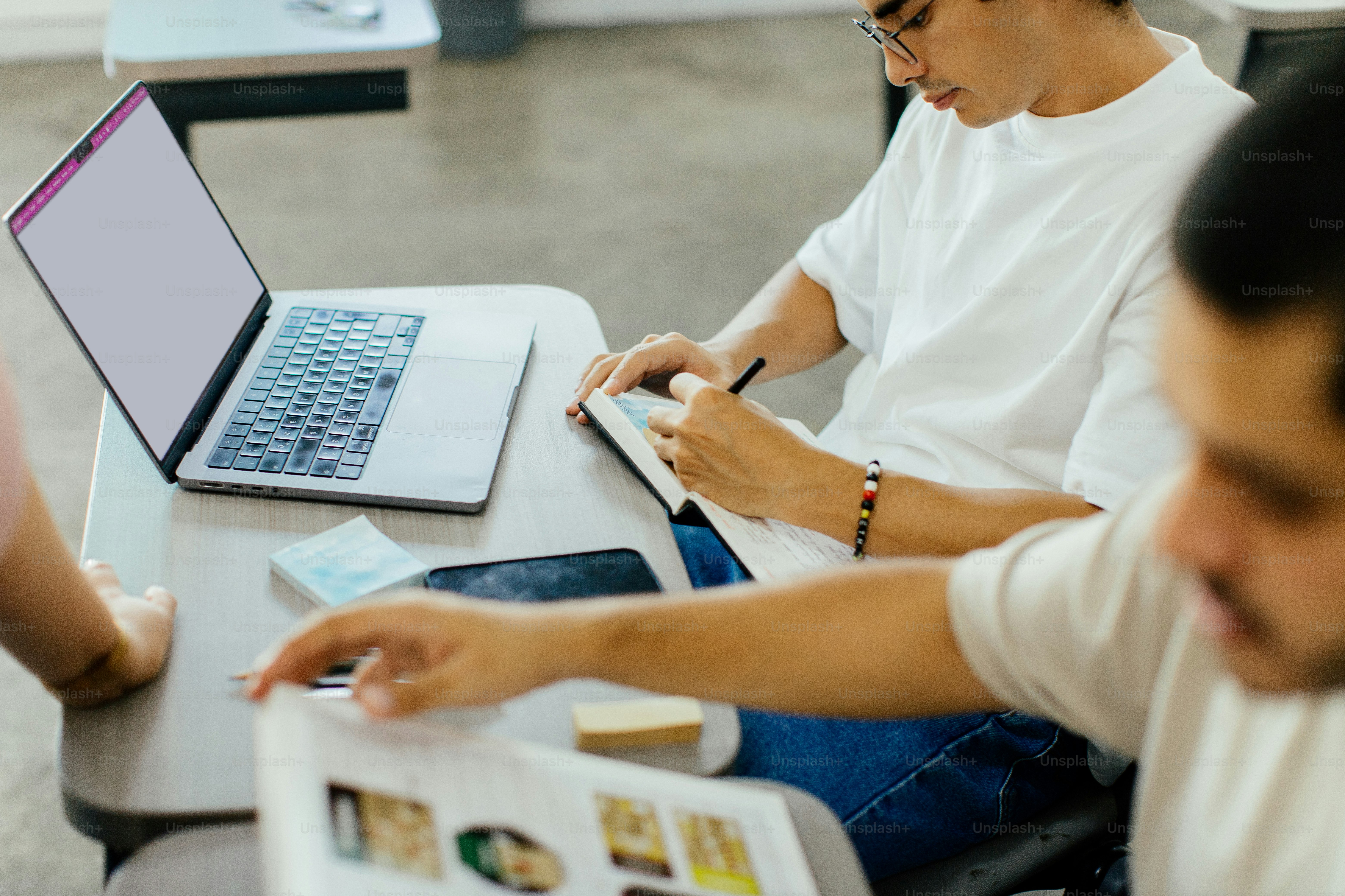 Students are taking notes and working at desks. photo – School Image on ...
