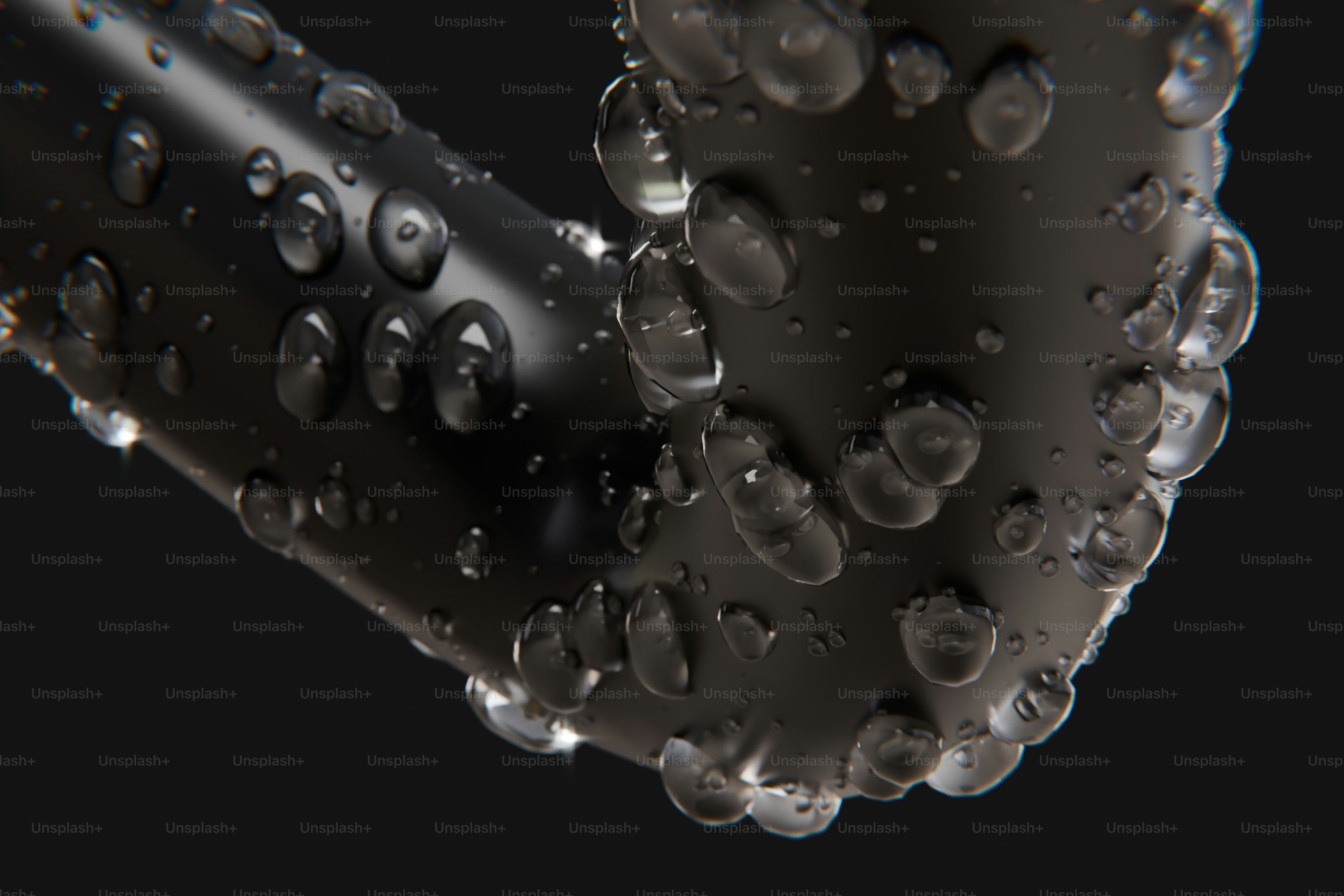 Water droplets cling to a black metal pipe. photo – Render Image on ...