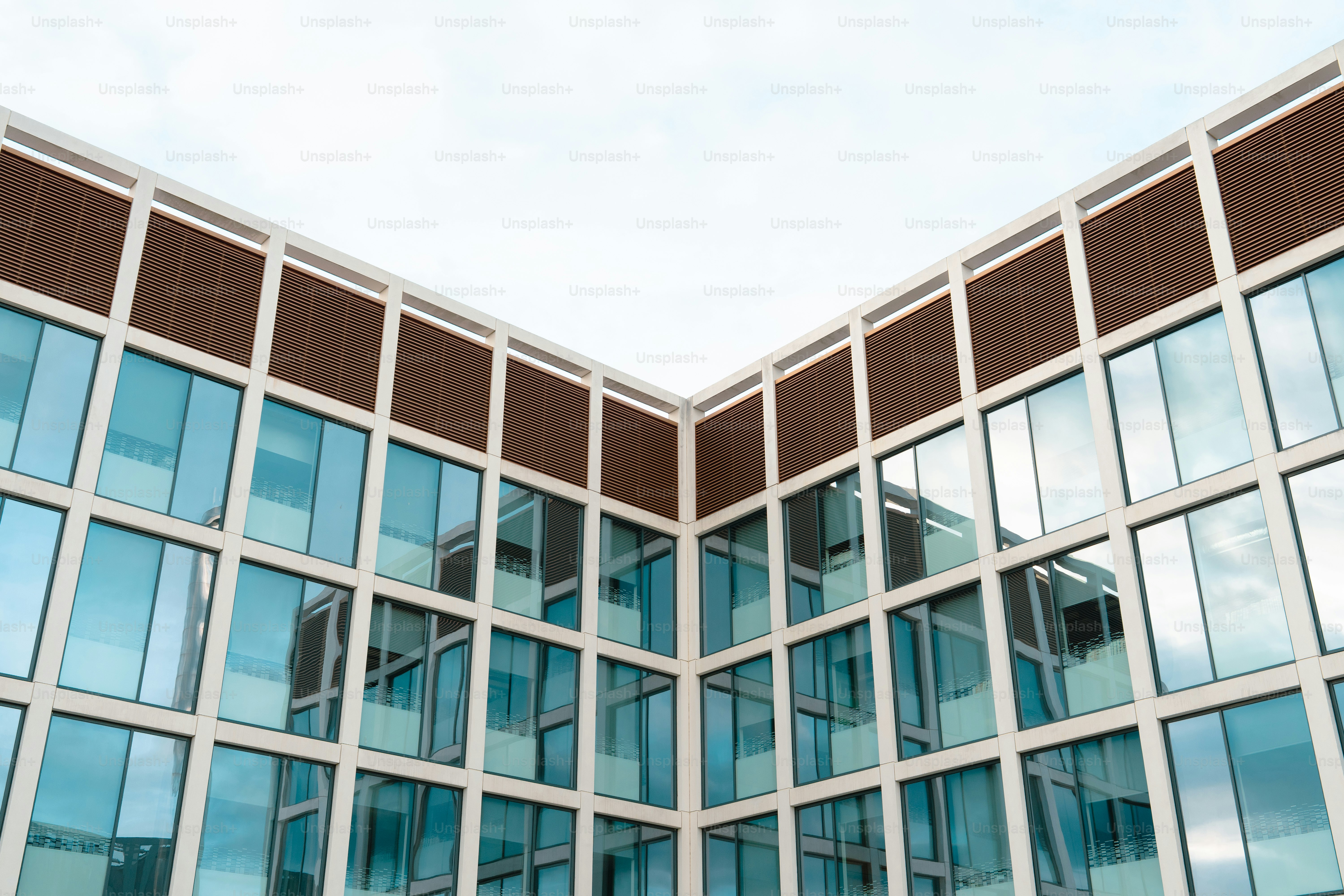 Modern building against a cloudy sky. photo – Symmetry Image on Unsplash