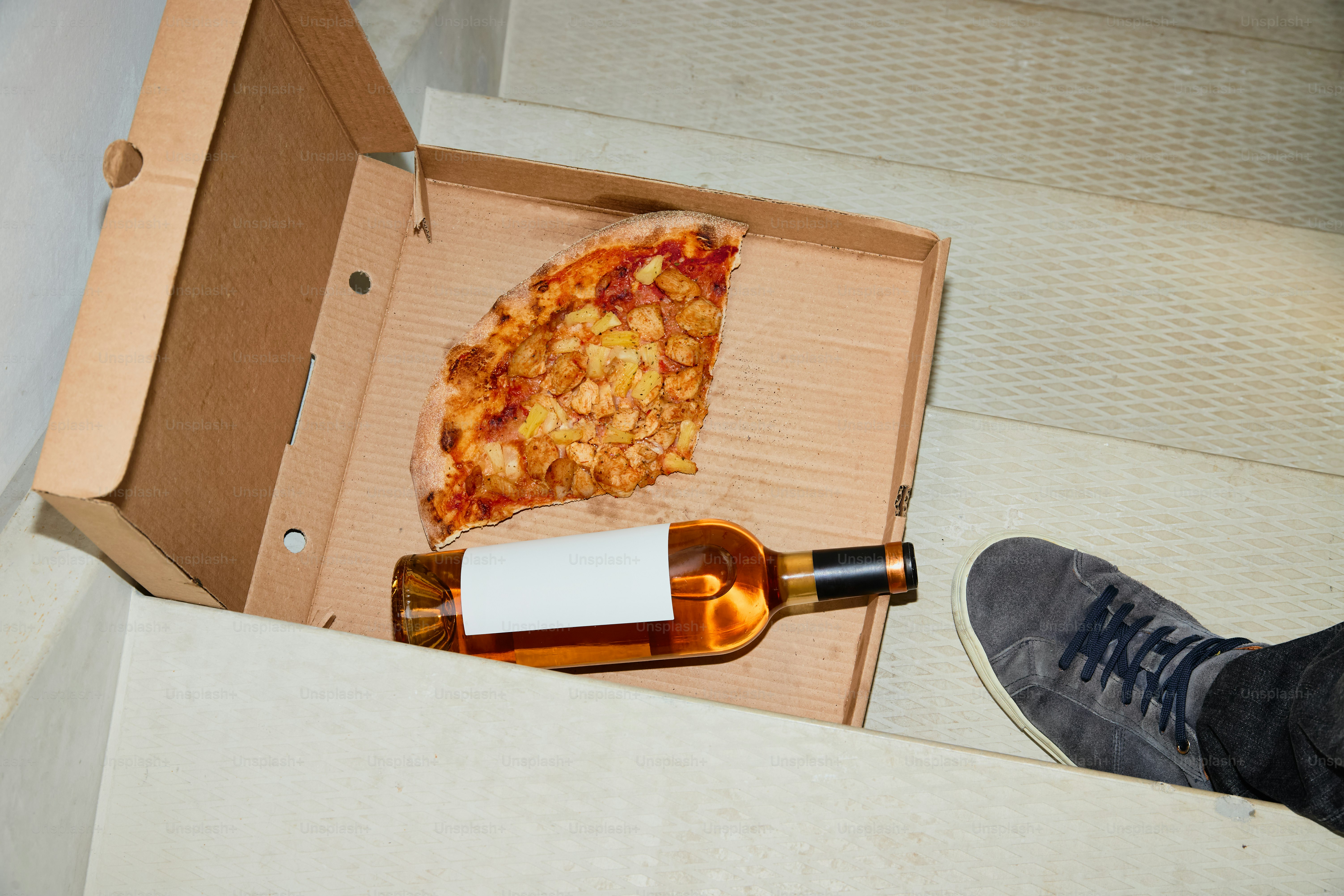 Pizza and wine on the stairs, ready for someone. photo – Natural Image ...