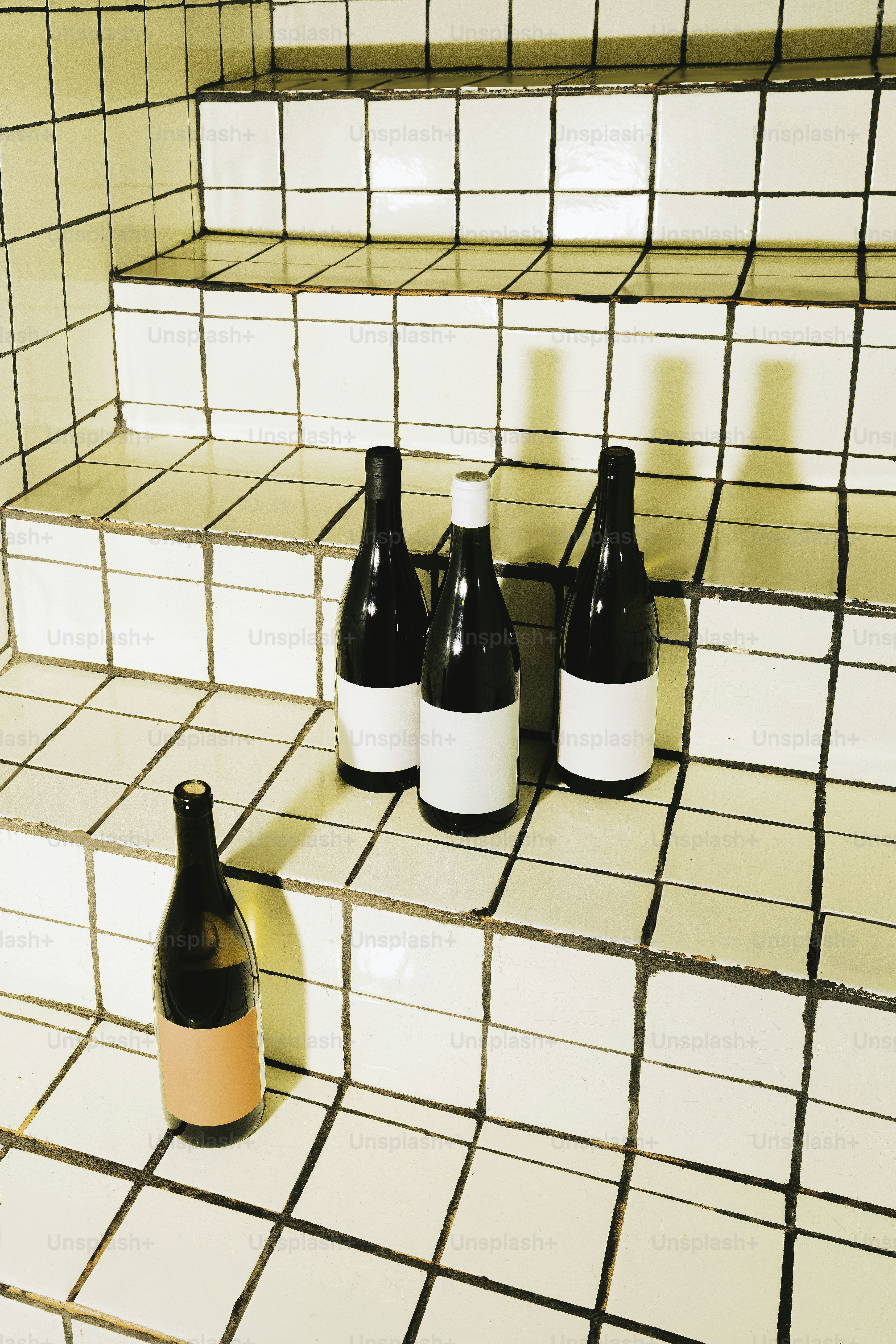 Bottles of wine are arranged on tiled stairs. photo – Natural Image on ...