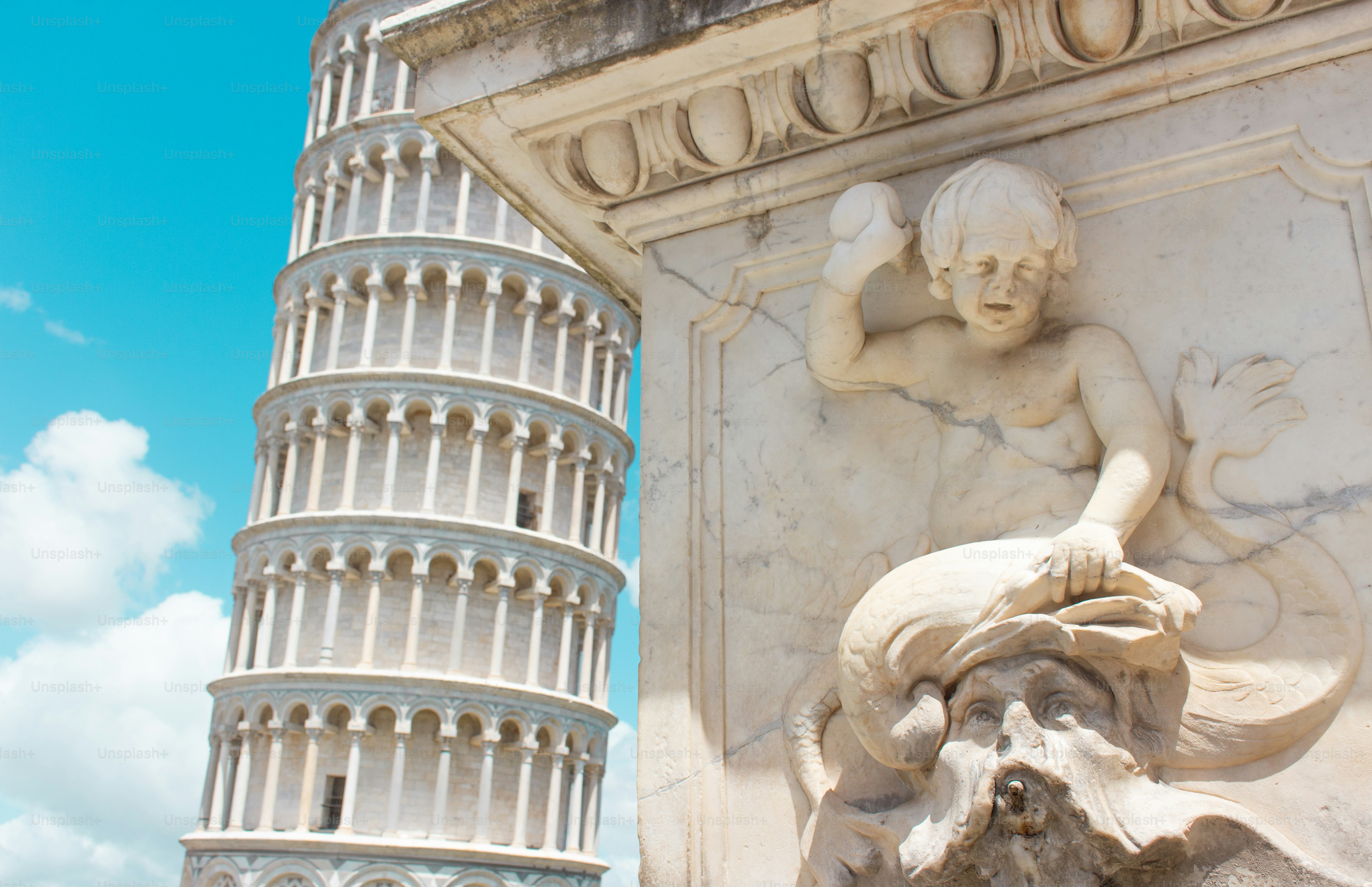 The leaning tower of pisa stands tall and proud. photo – Statue Image ...