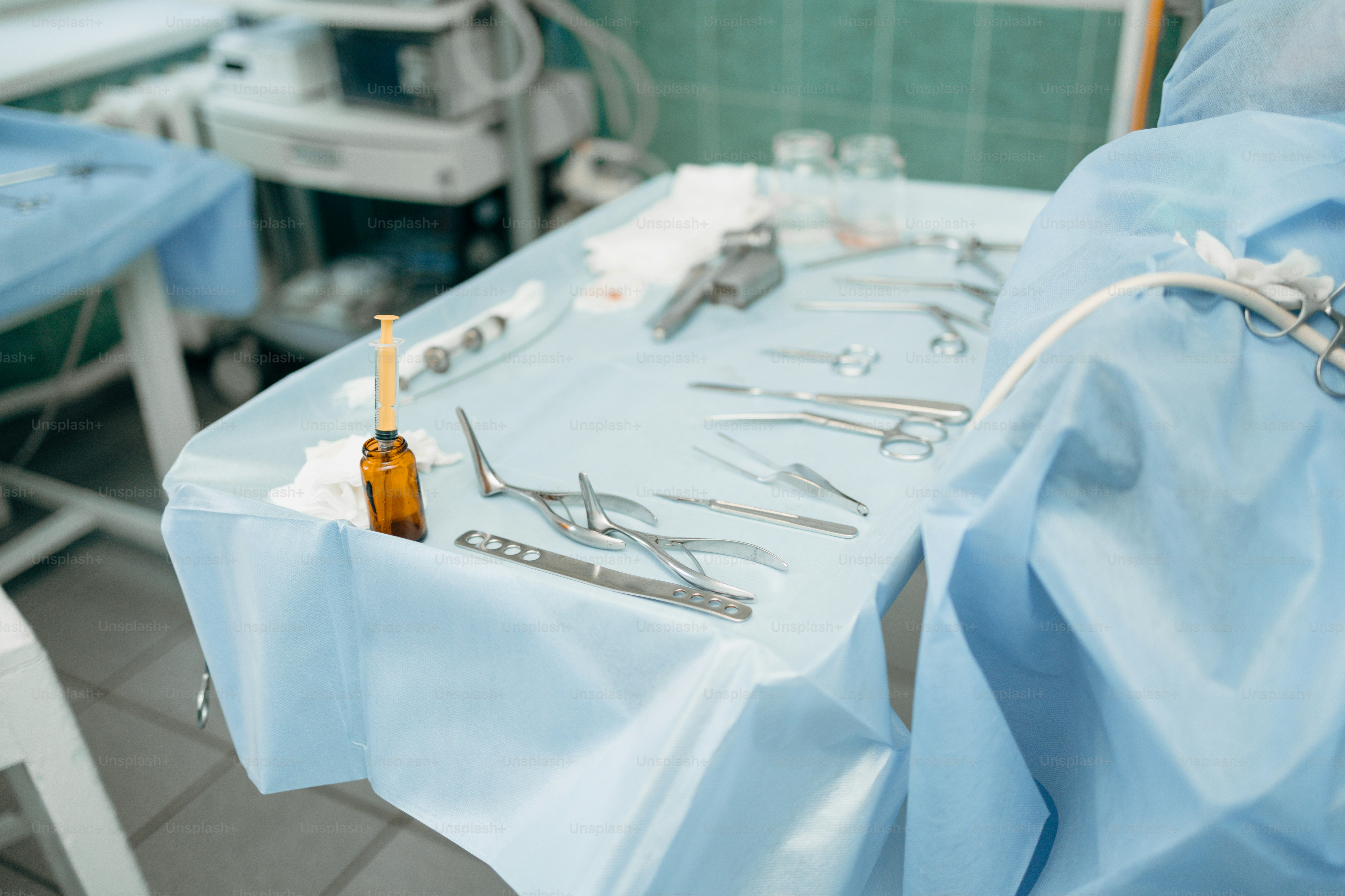 Surgical instruments are arranged on a sterile table. photo – Doctor ...