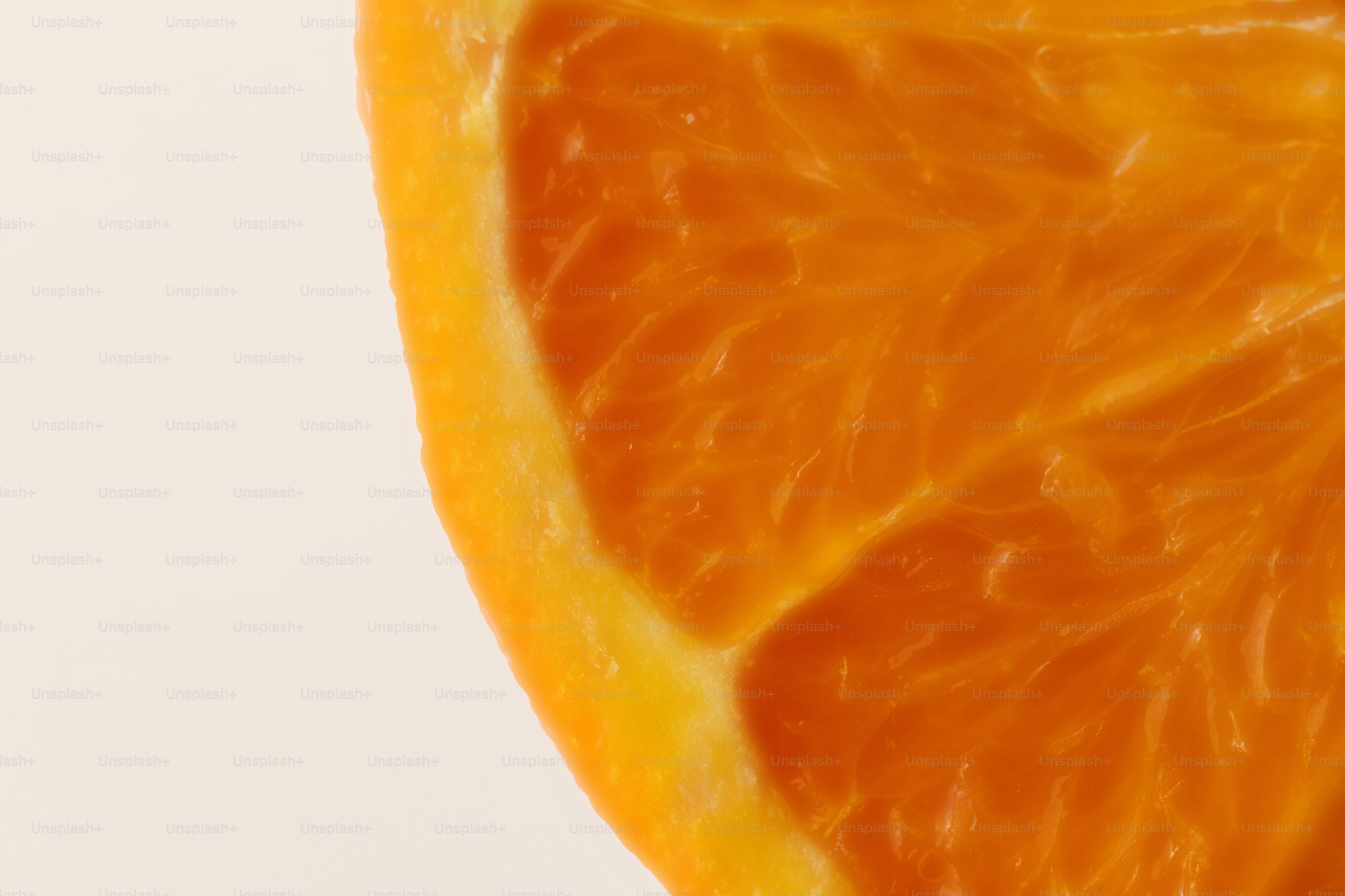 An orange slice, up close. photo – Food Image on Unsplash
