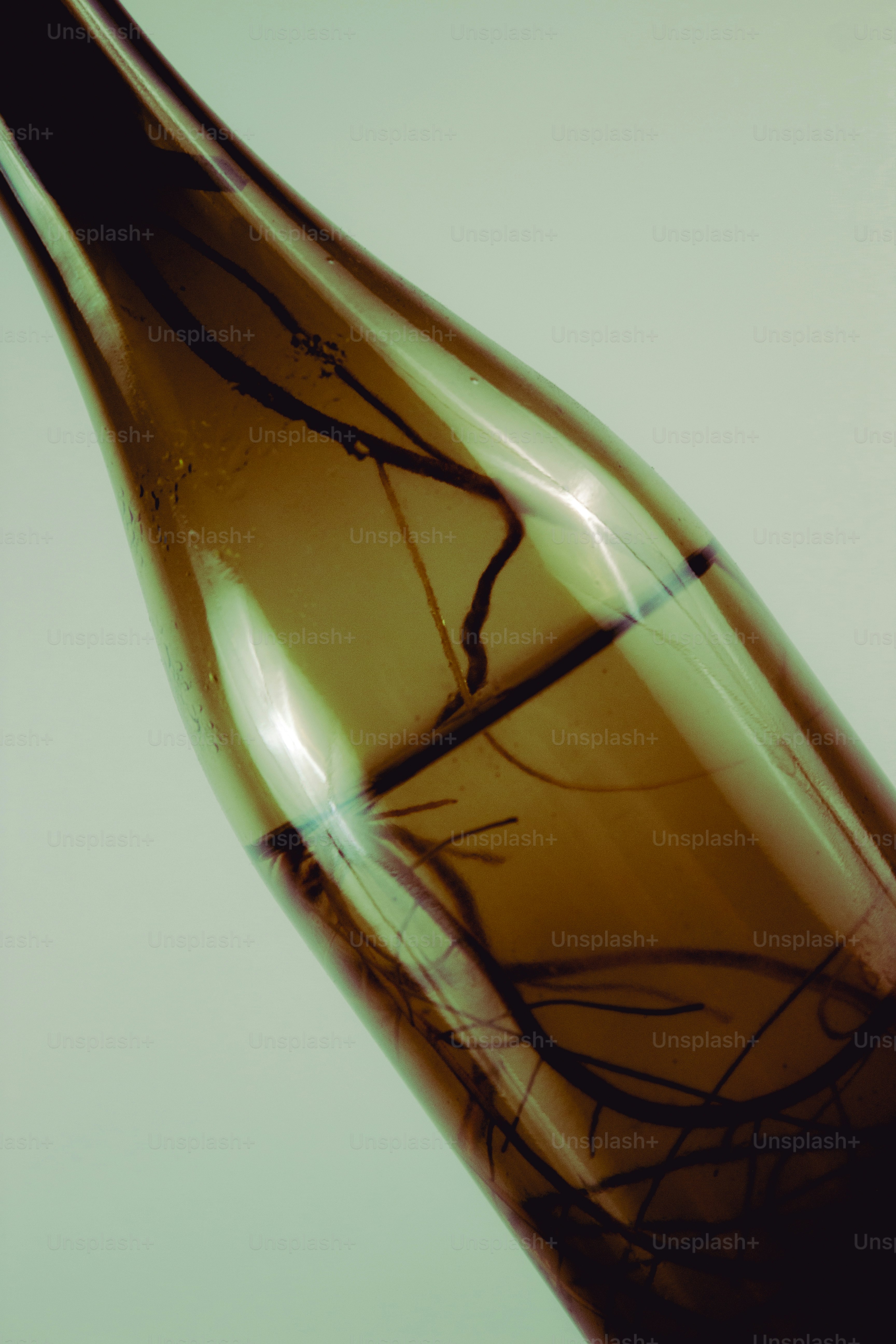 Bottles close-up, one with a dark band. photo – Bottle Image on Unsplash