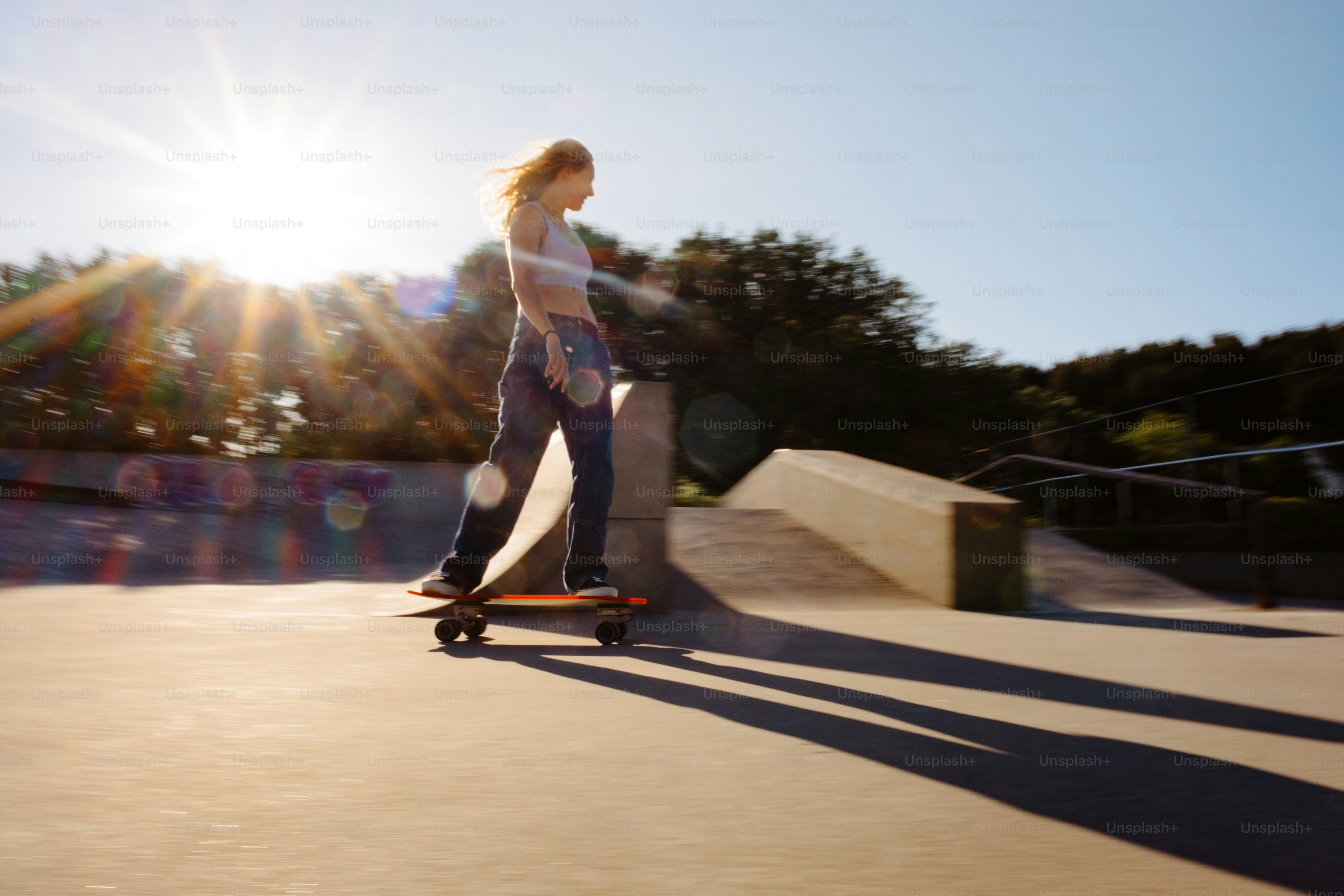 Girl skateboarding in a skate park on a sunny day. photo – Sport Image ...