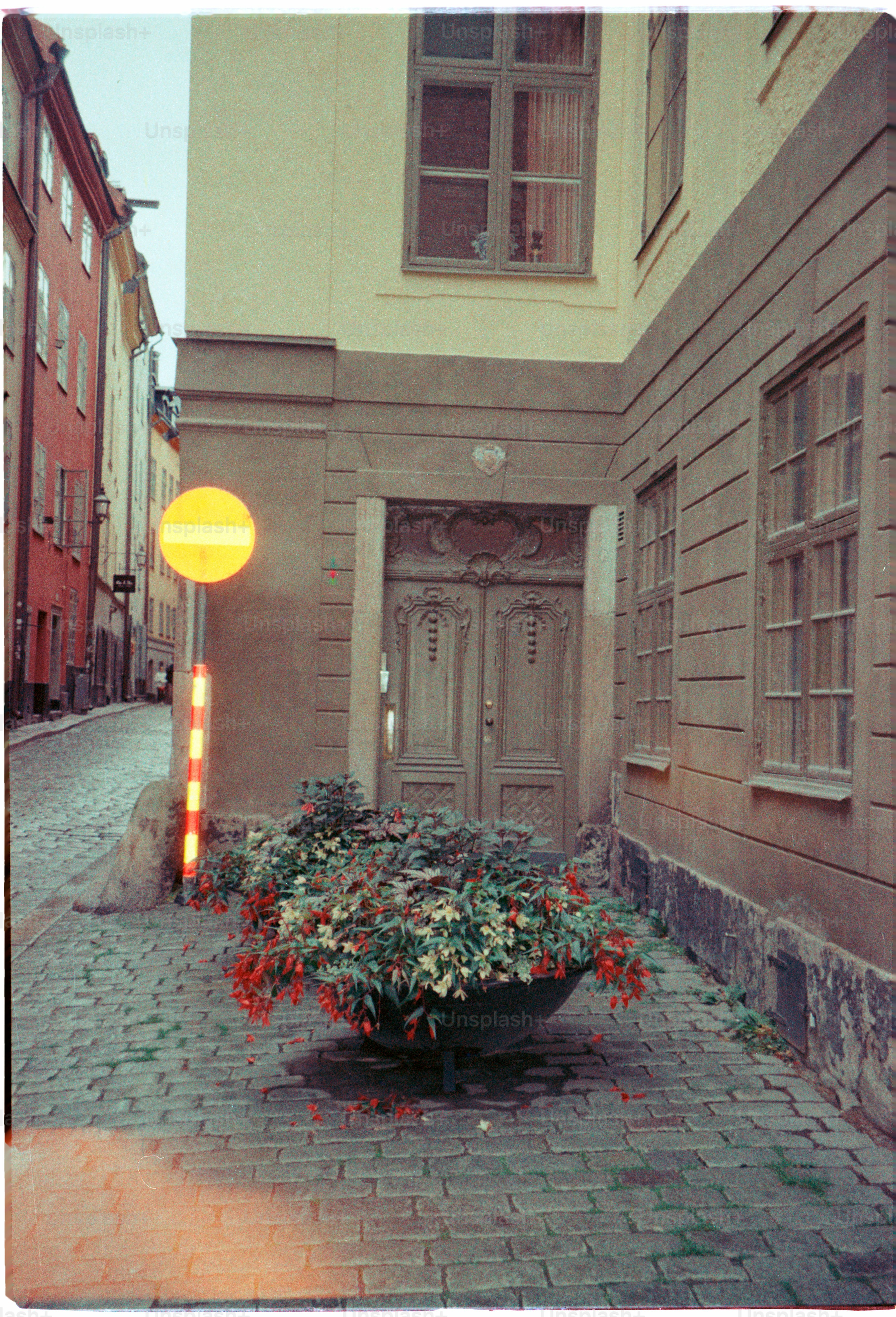 A quaint european street corner is pictured. photo – Sweden Image on ...
