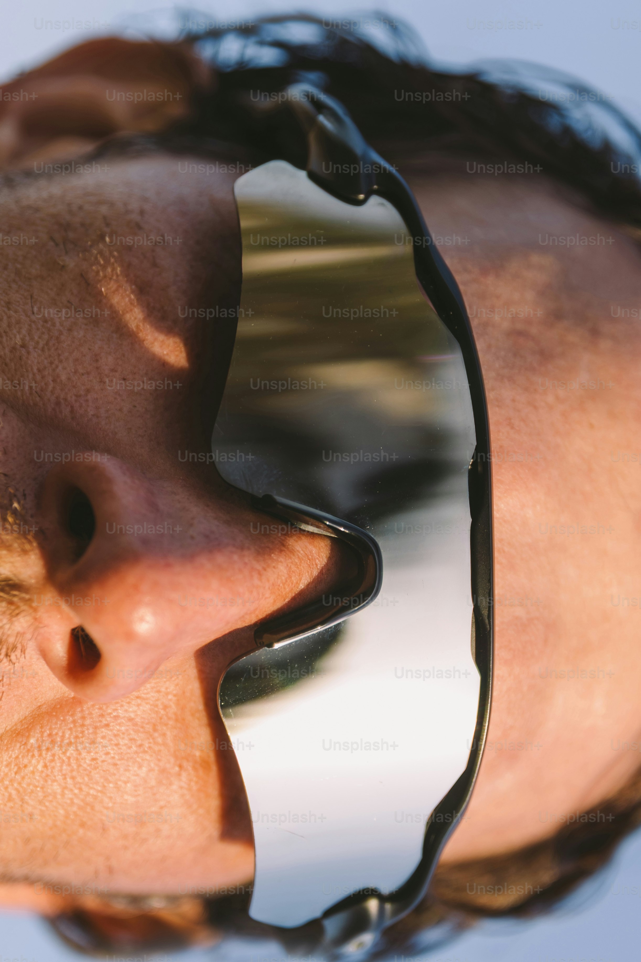 Sunglasses reflecting a scene on someone's face. photo – Fashion Image ...
