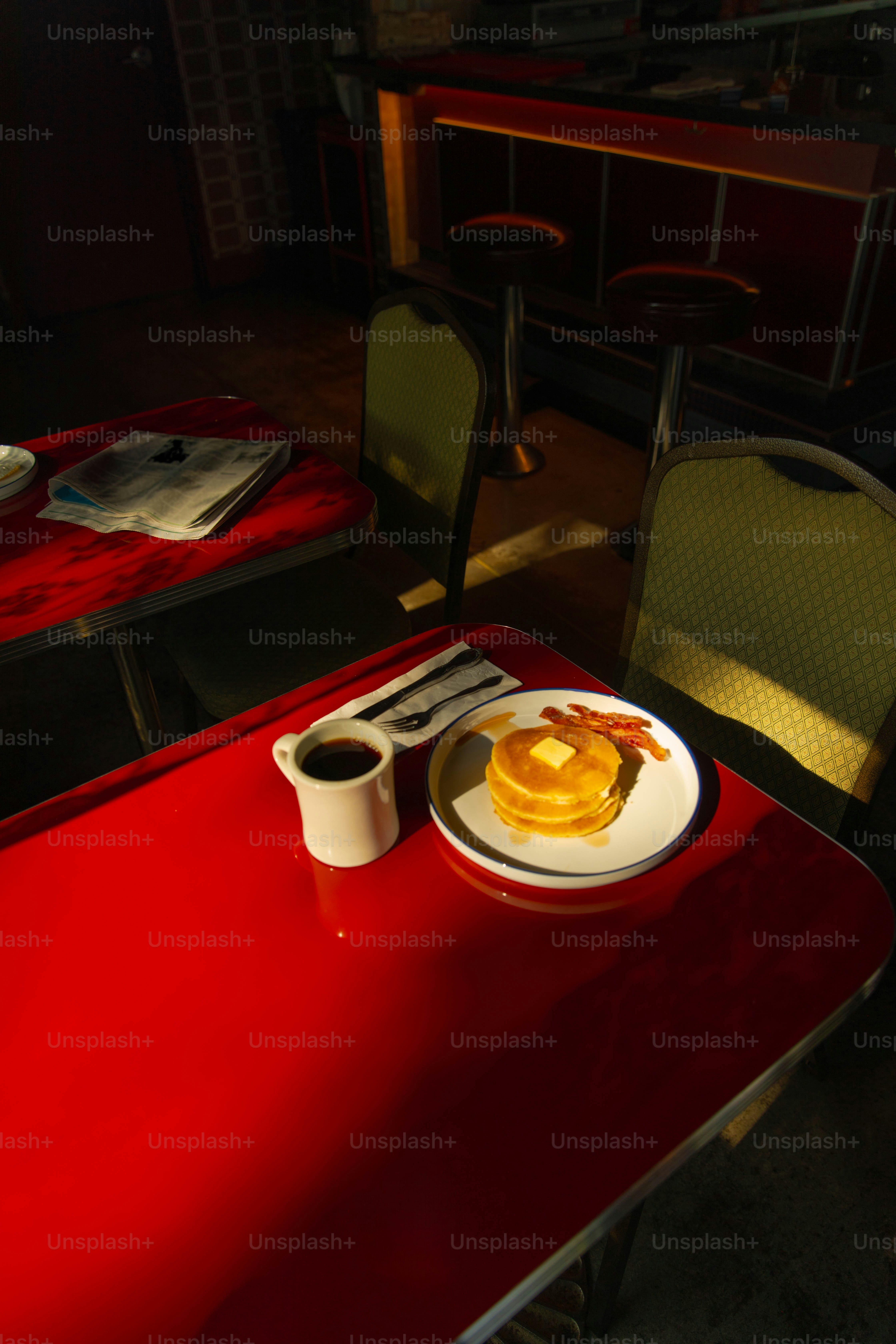 Breakfast is ready on the red diner table. photo – Food Image on Unsplash