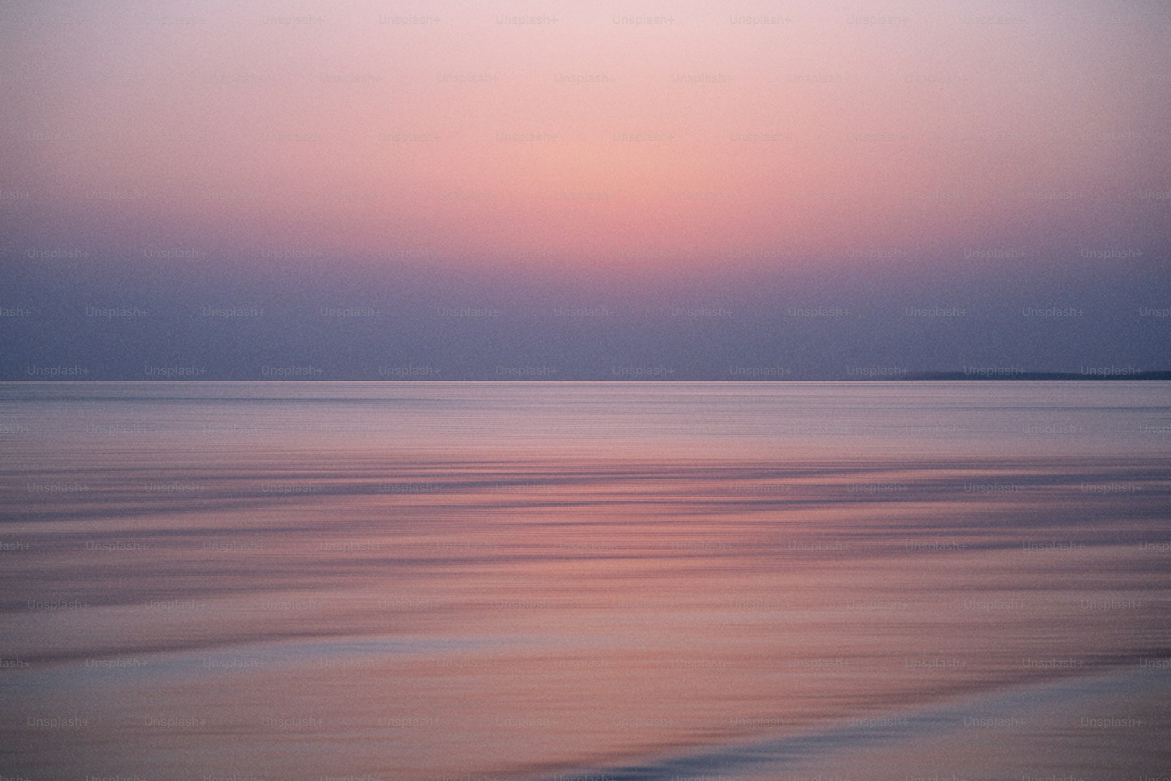 The sunset sky reflects upon the calm water. photo – Abstract Image on ...