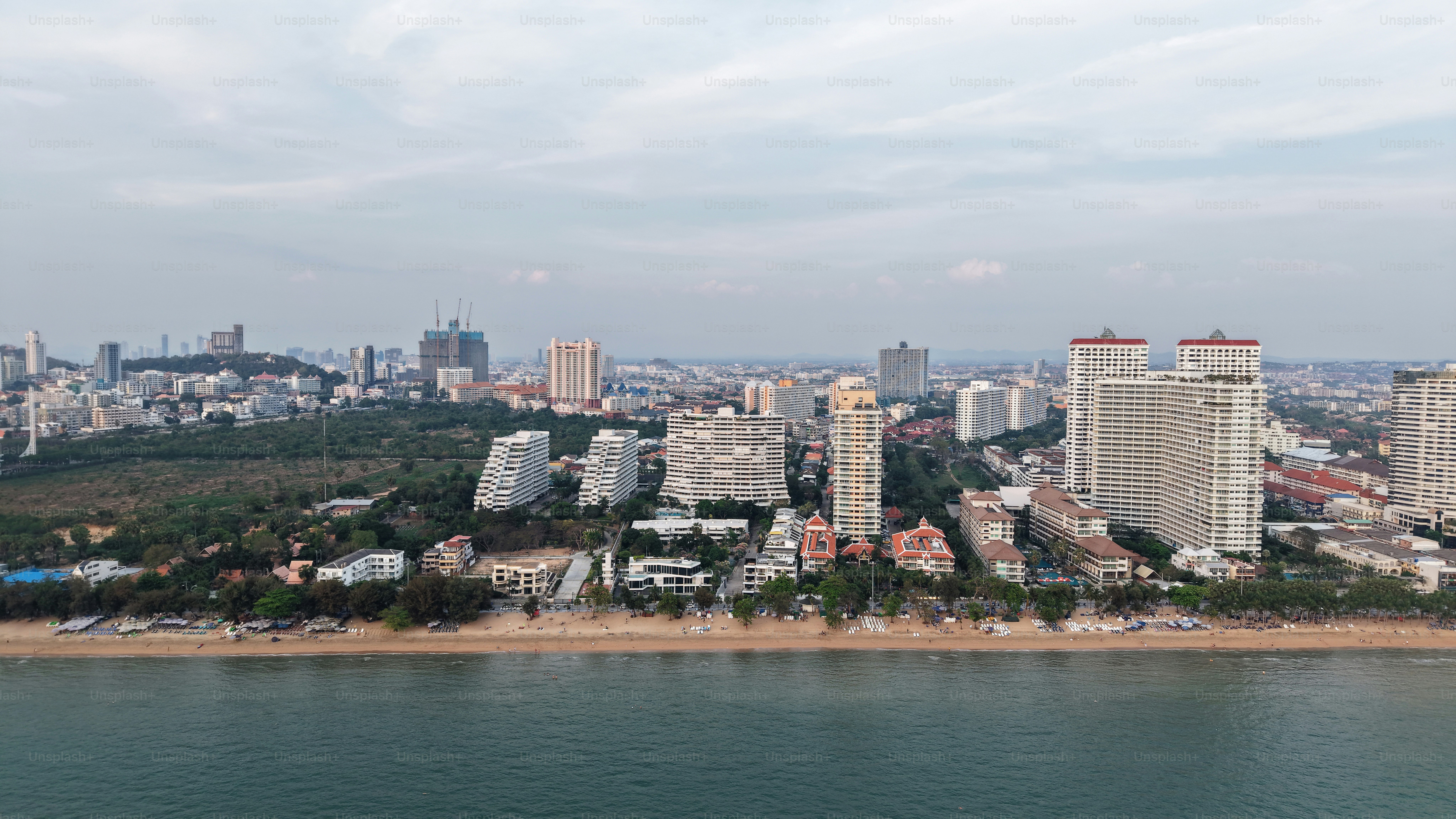 Modern buildings rising along the pattaya coastline create a stunning ...