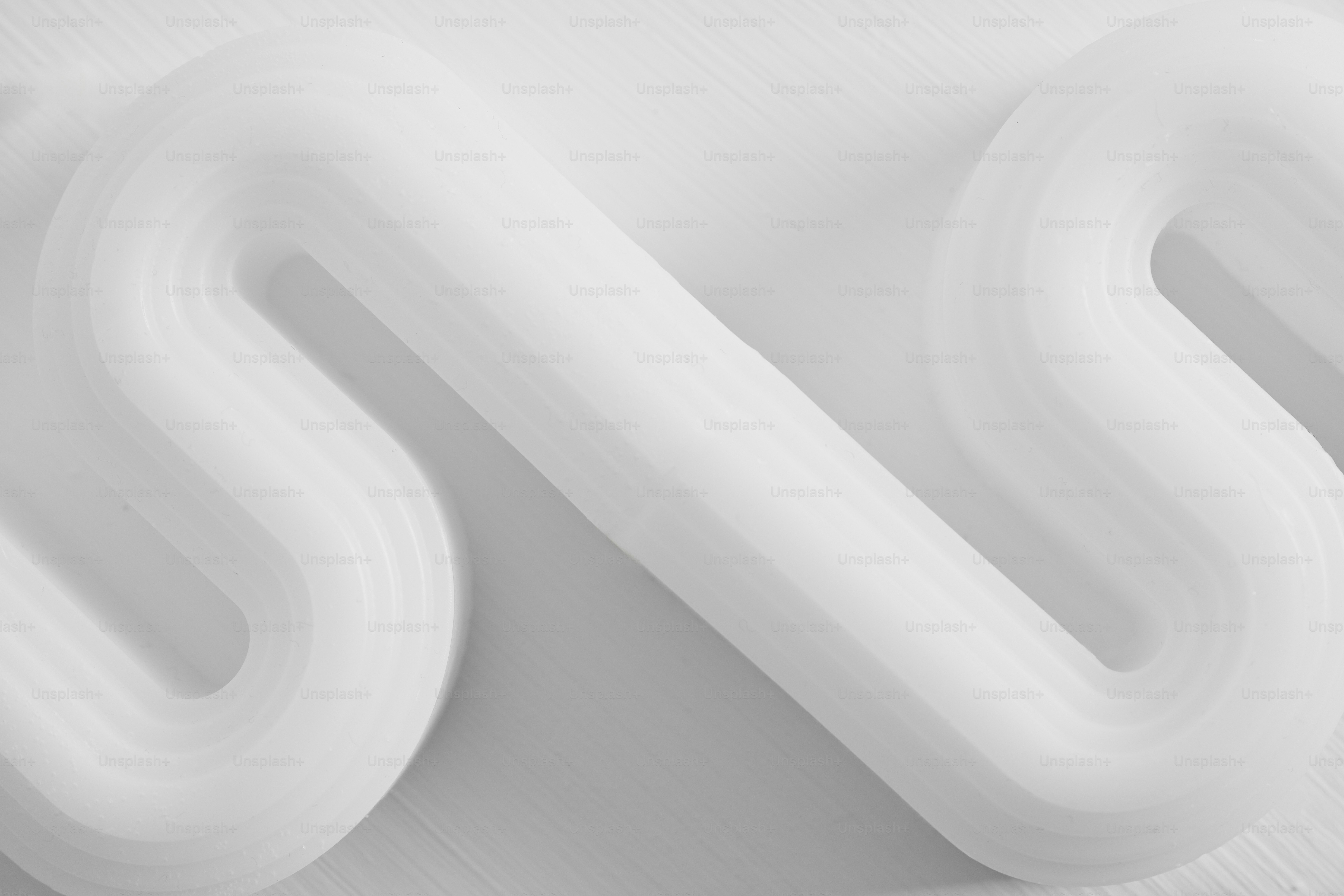 White, s-shaped design on a gray background. photo – Wallpaper Image on ...