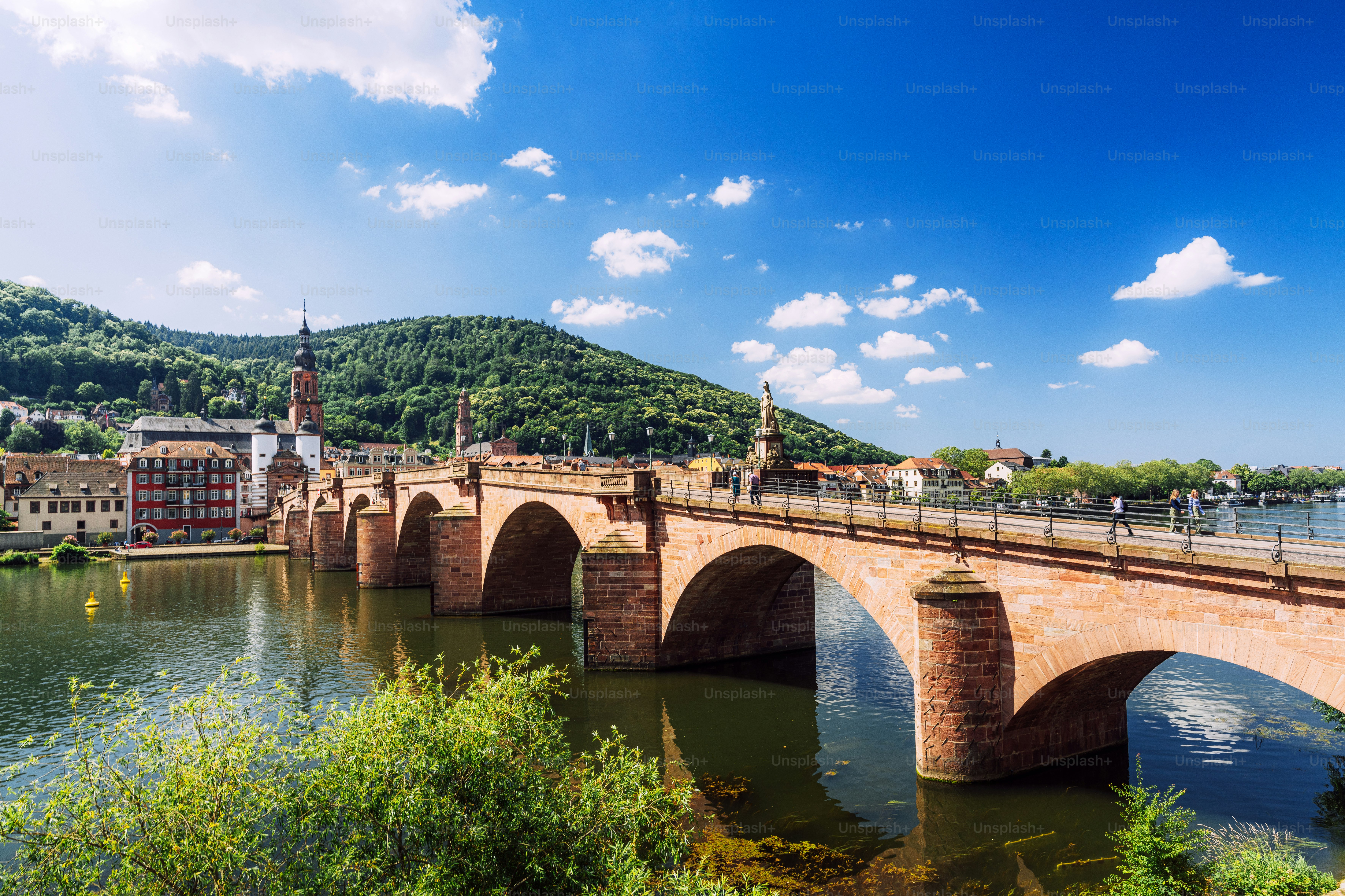 Scenic view of the historic bridge over a river in Heidelberg, Germany ...
