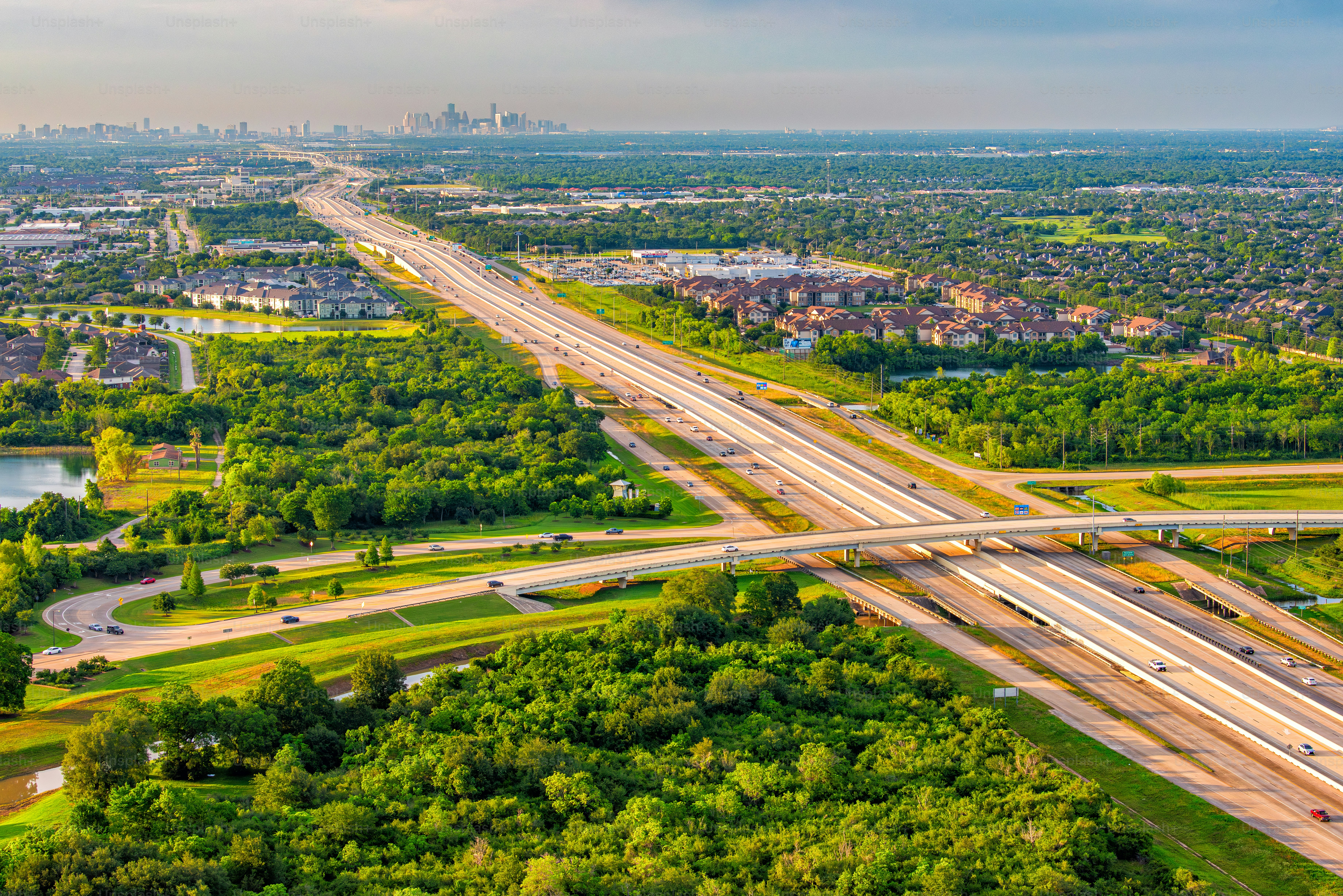 Aerial view of a freeway bisecting the suburbs leading to downtown ...