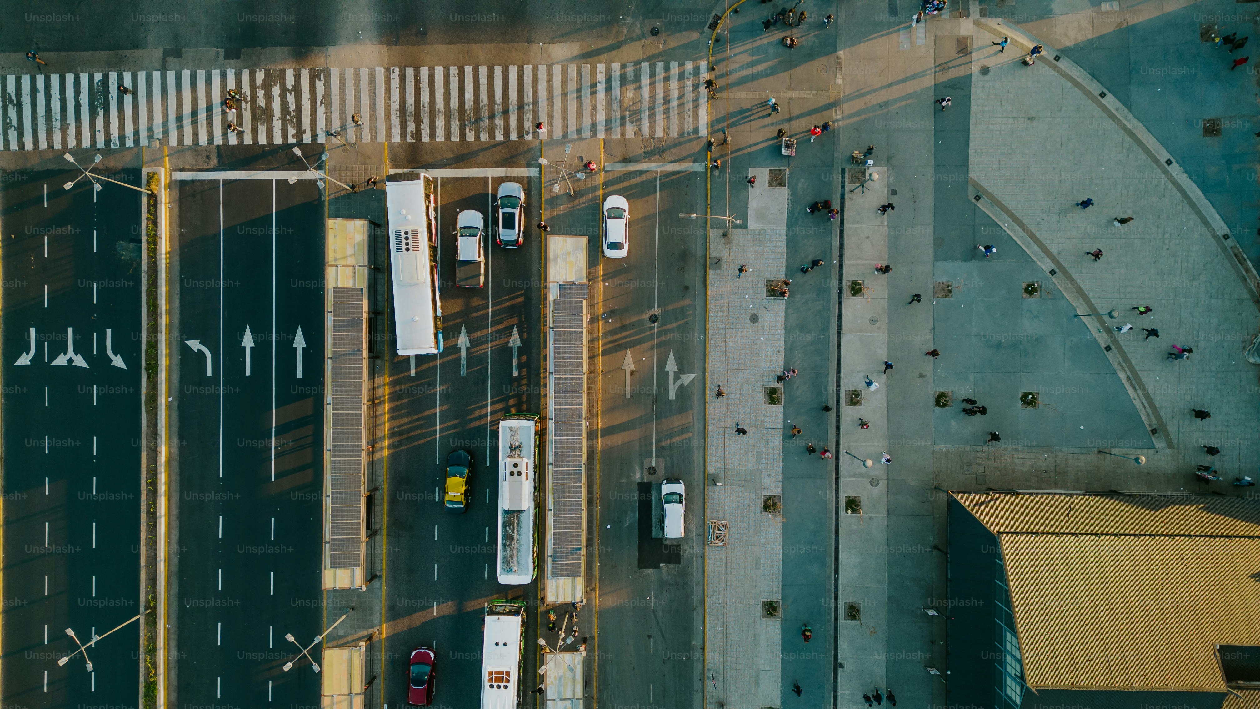 Bus stations and pedestrians passing on the sidewalk heading home photo ...