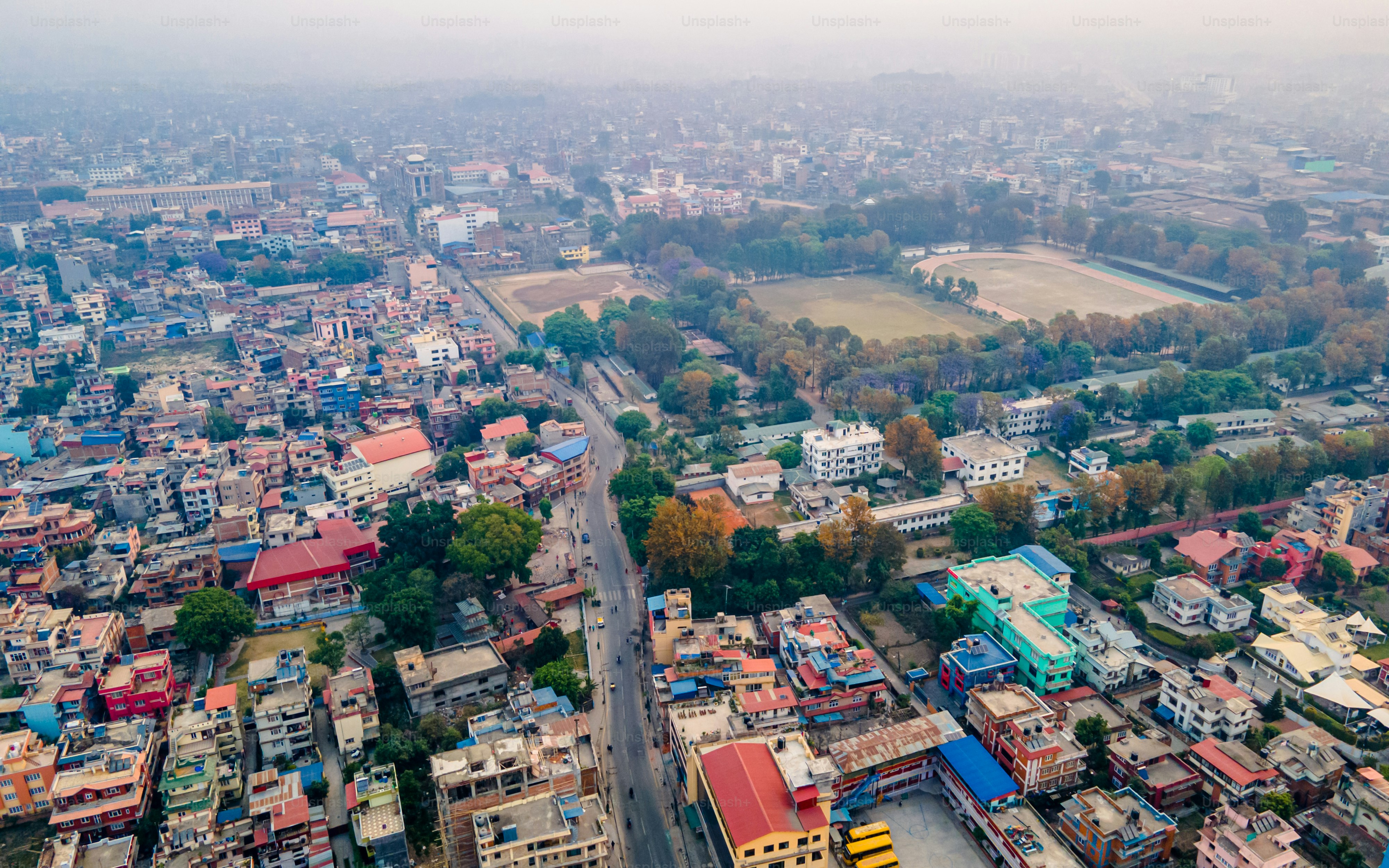 Aerial view of blossom Jacaranda flower ring road highway in kathmandu ...