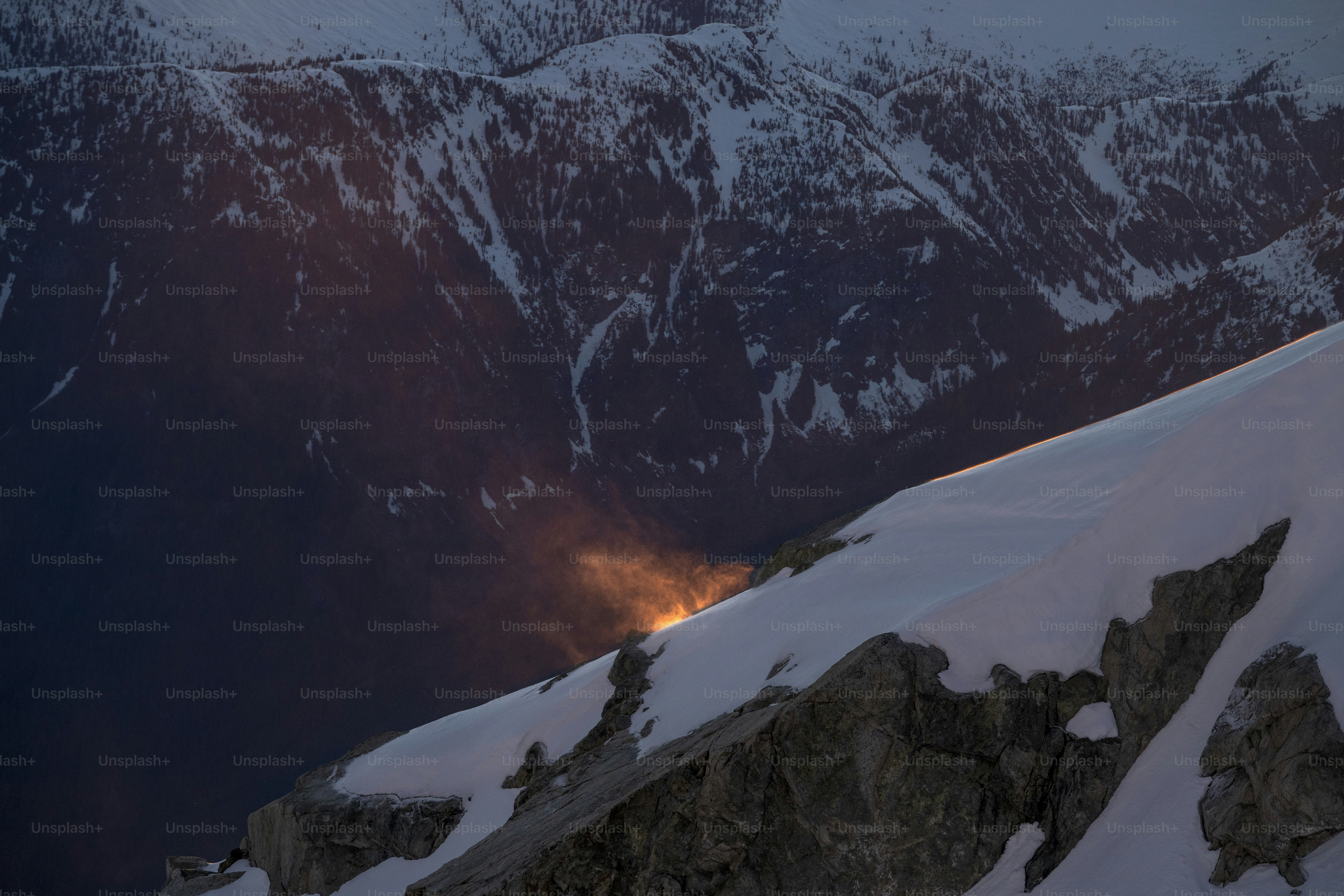 Alpine glow on mountain peak and headlamps from ski mountaineers, Tantalus Ranges photo – Travel ...