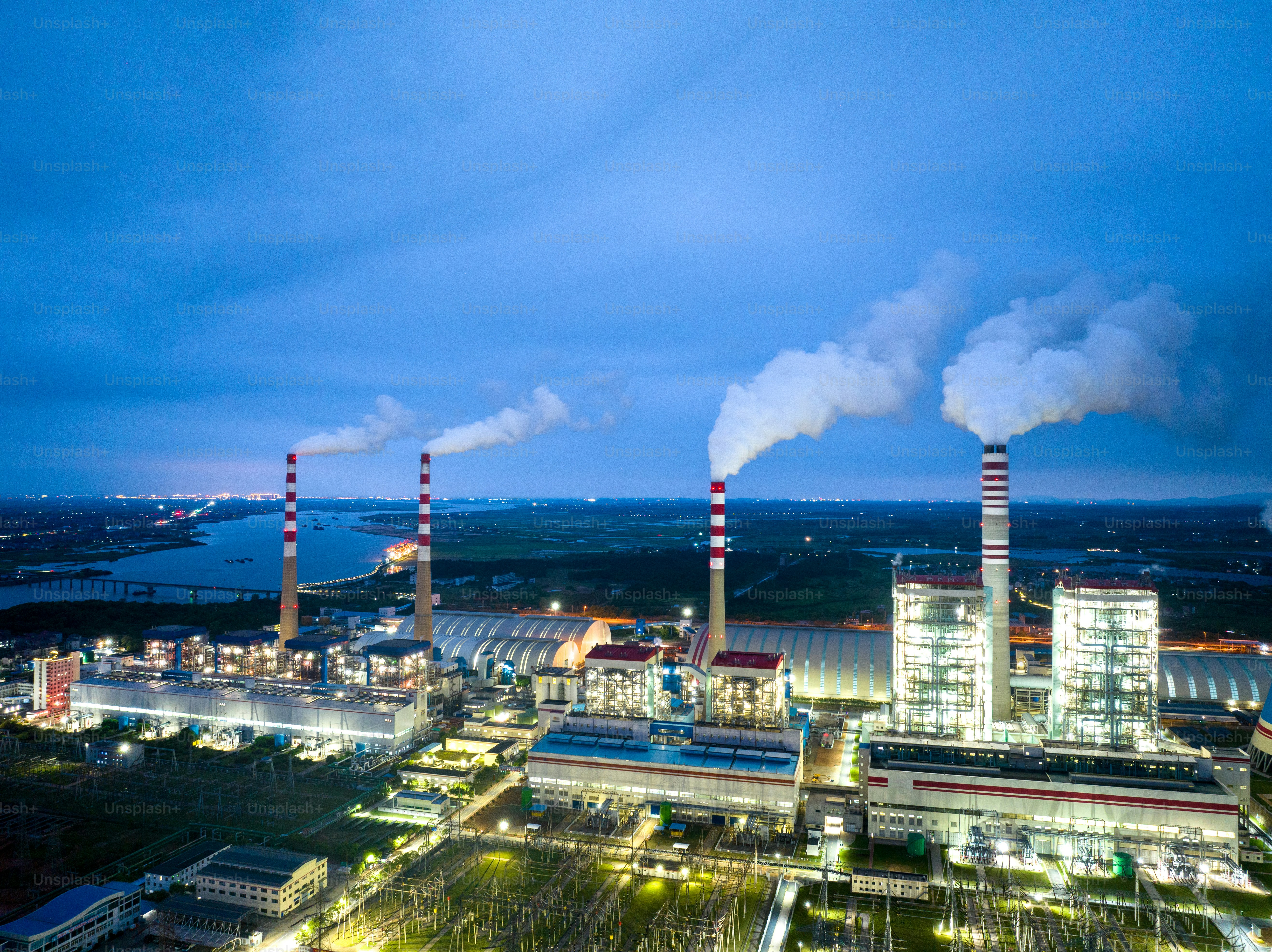 Aerial photography of large thermal power plant at night photo – City ...