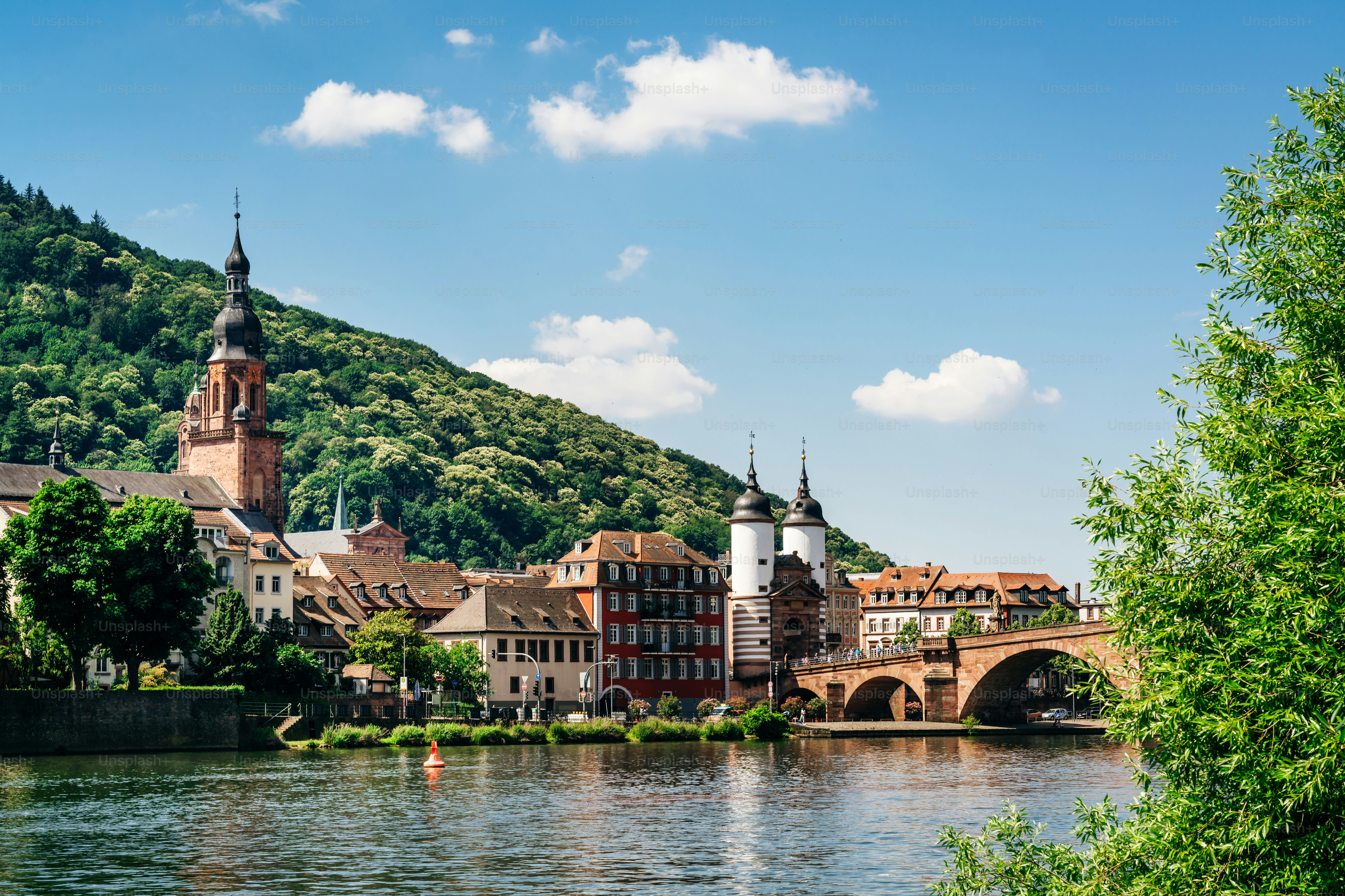 Scenic view of the historic bridge over a river in Heidelberg, Germany ...
