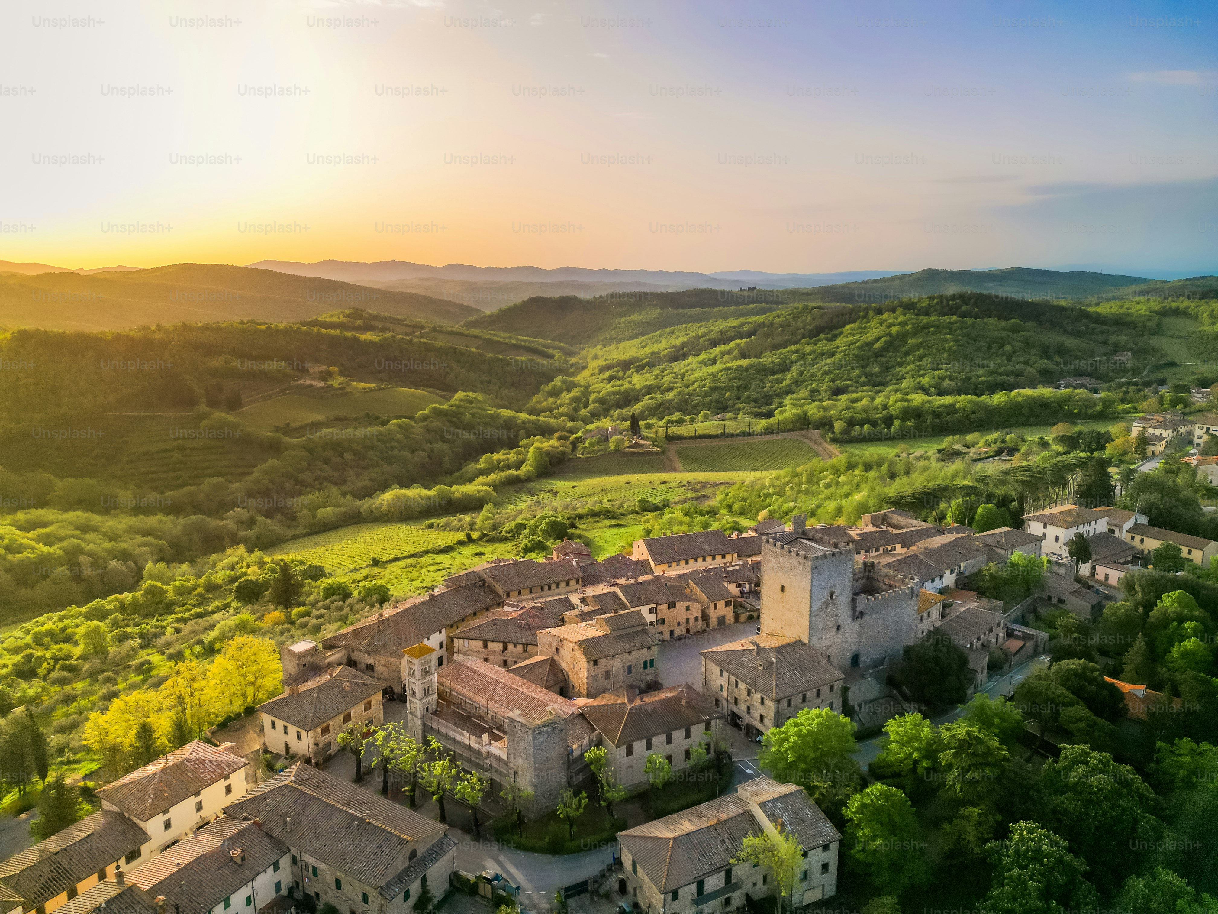 Aerial view of beautiful Italian old town at sunset, Castellina in ...