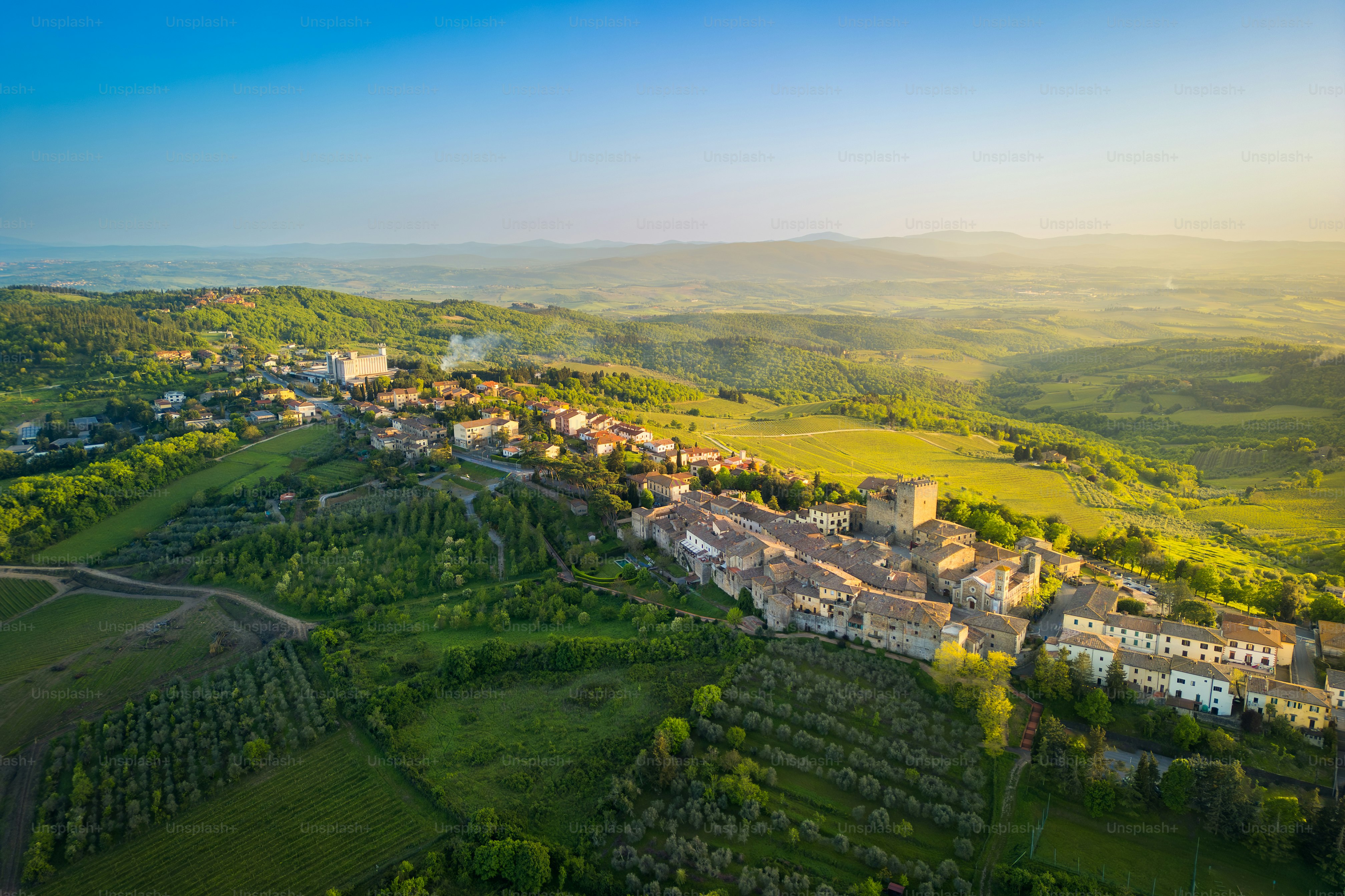 Aerial view of beautiful Italian old town at sunset, Castellina in ...