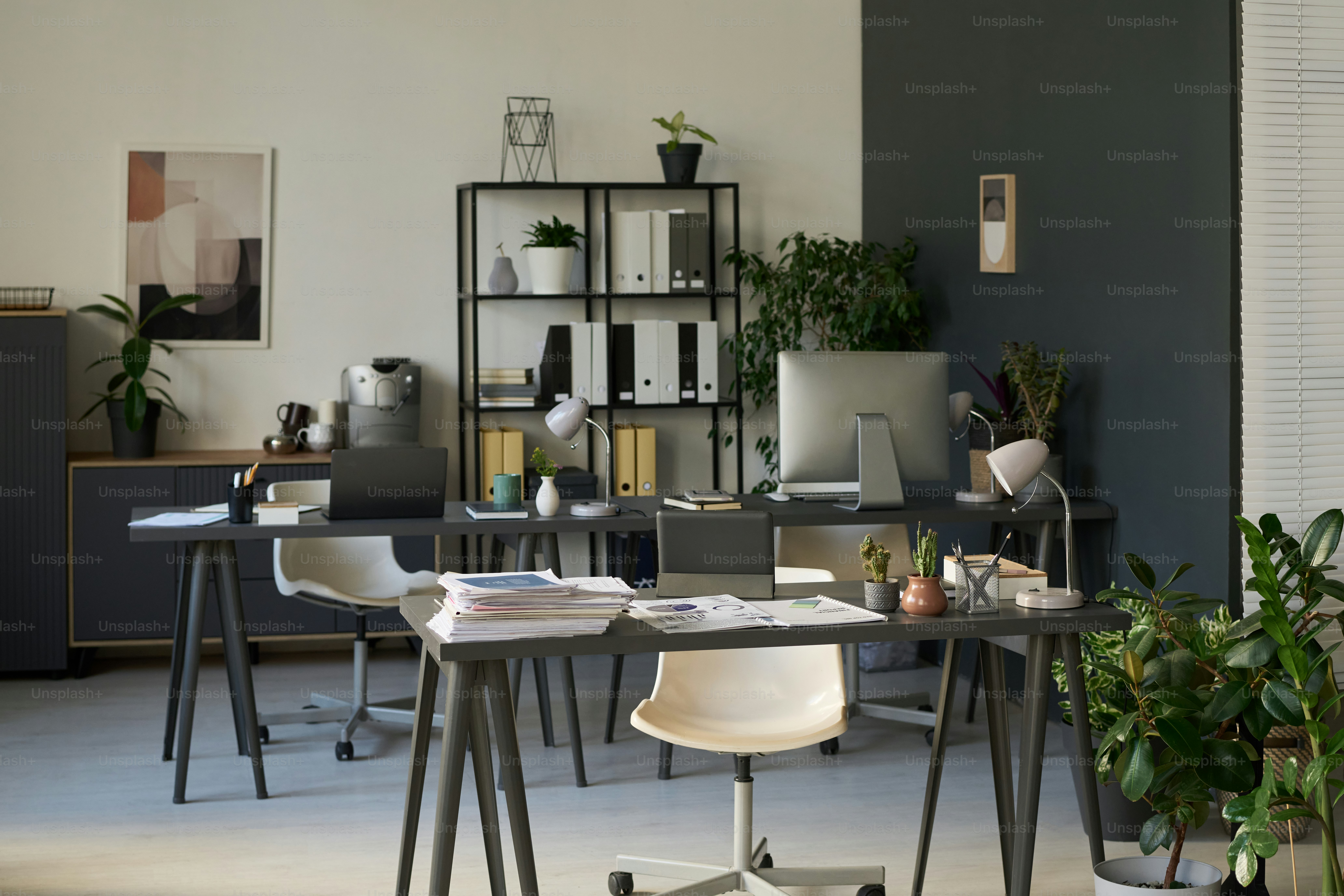 Workplaces of financial analysts with computers, lamps and stacks of ...