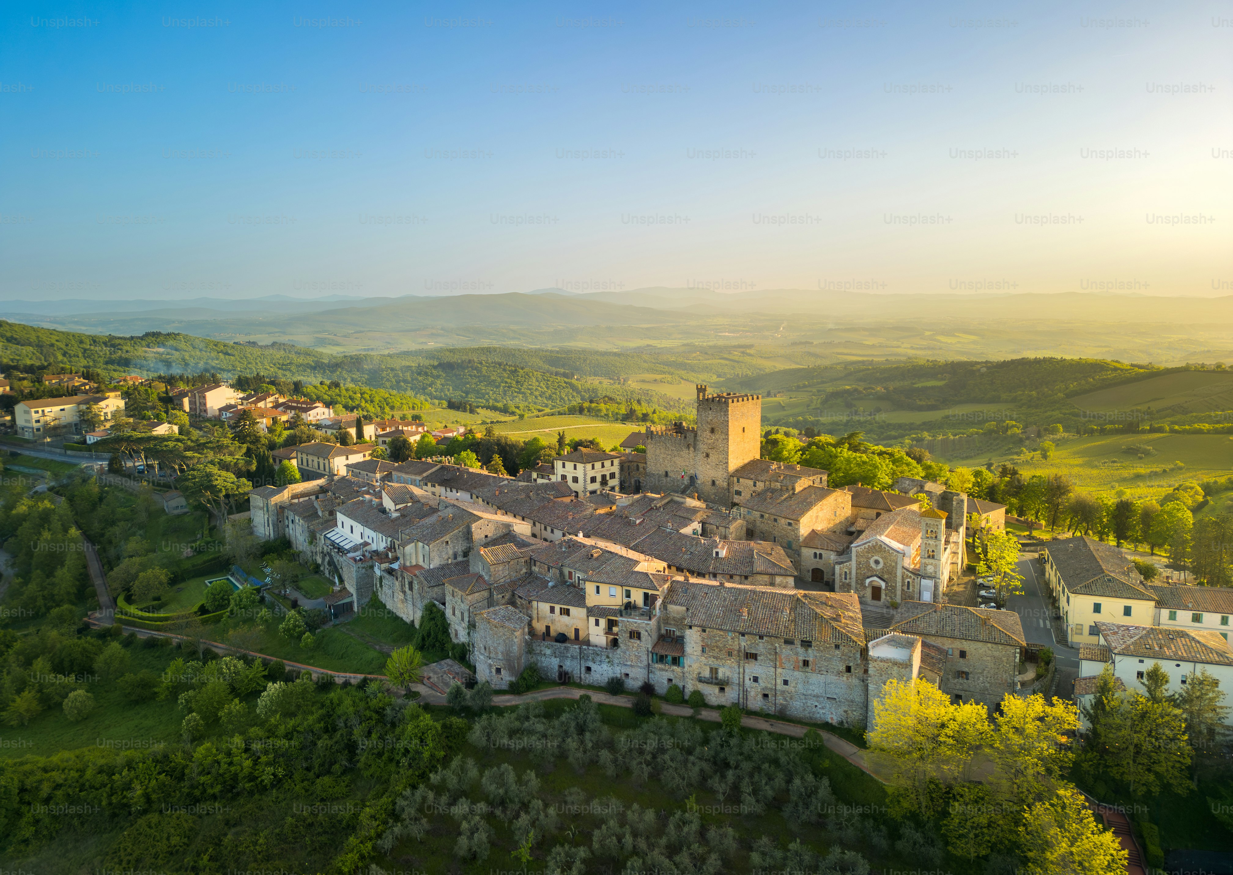 Aerial view of beautiful Italian old town at sunset, Castellina in ...