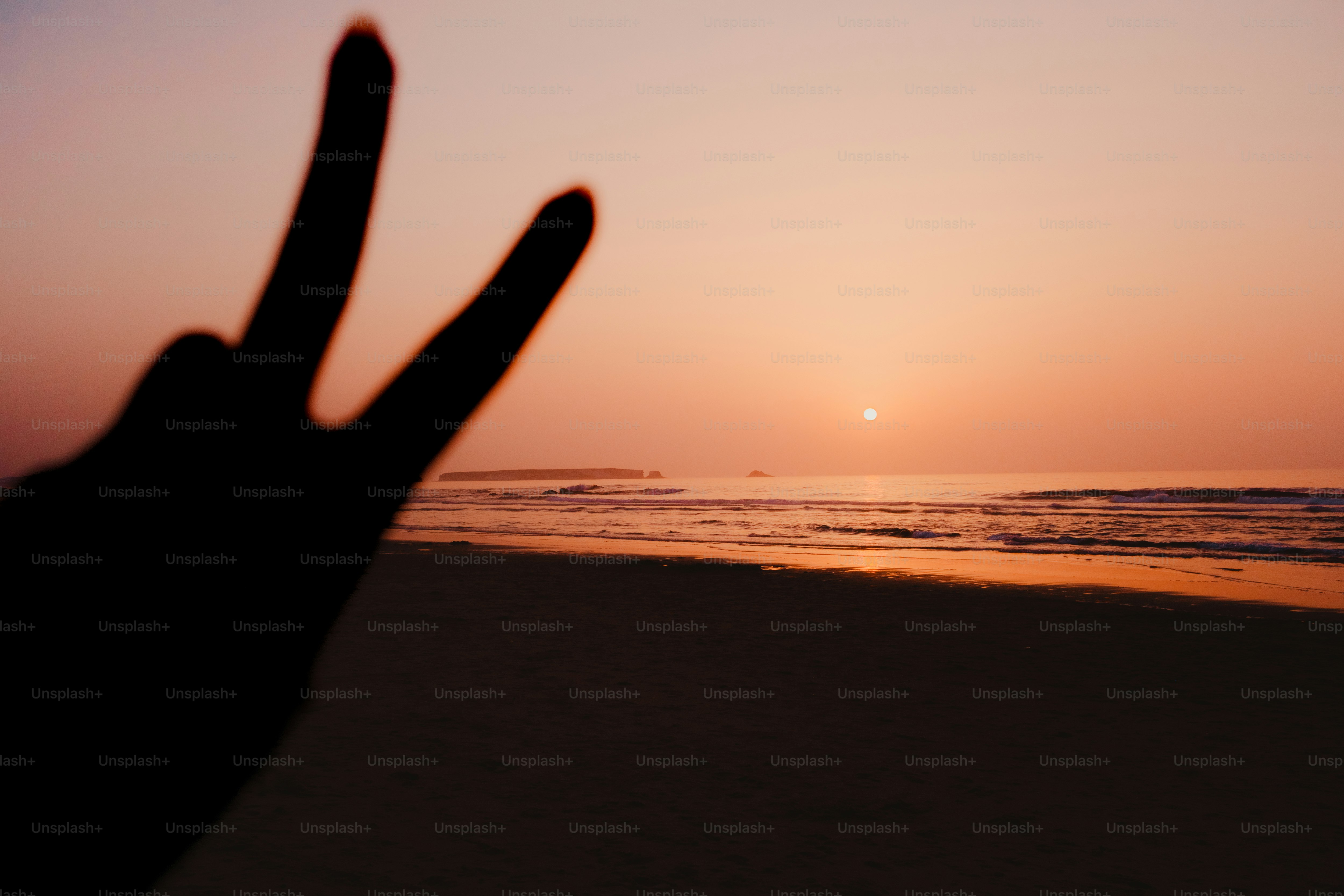 Peace sign in silhouette with sunset beach view. photo – Beach Image on ...