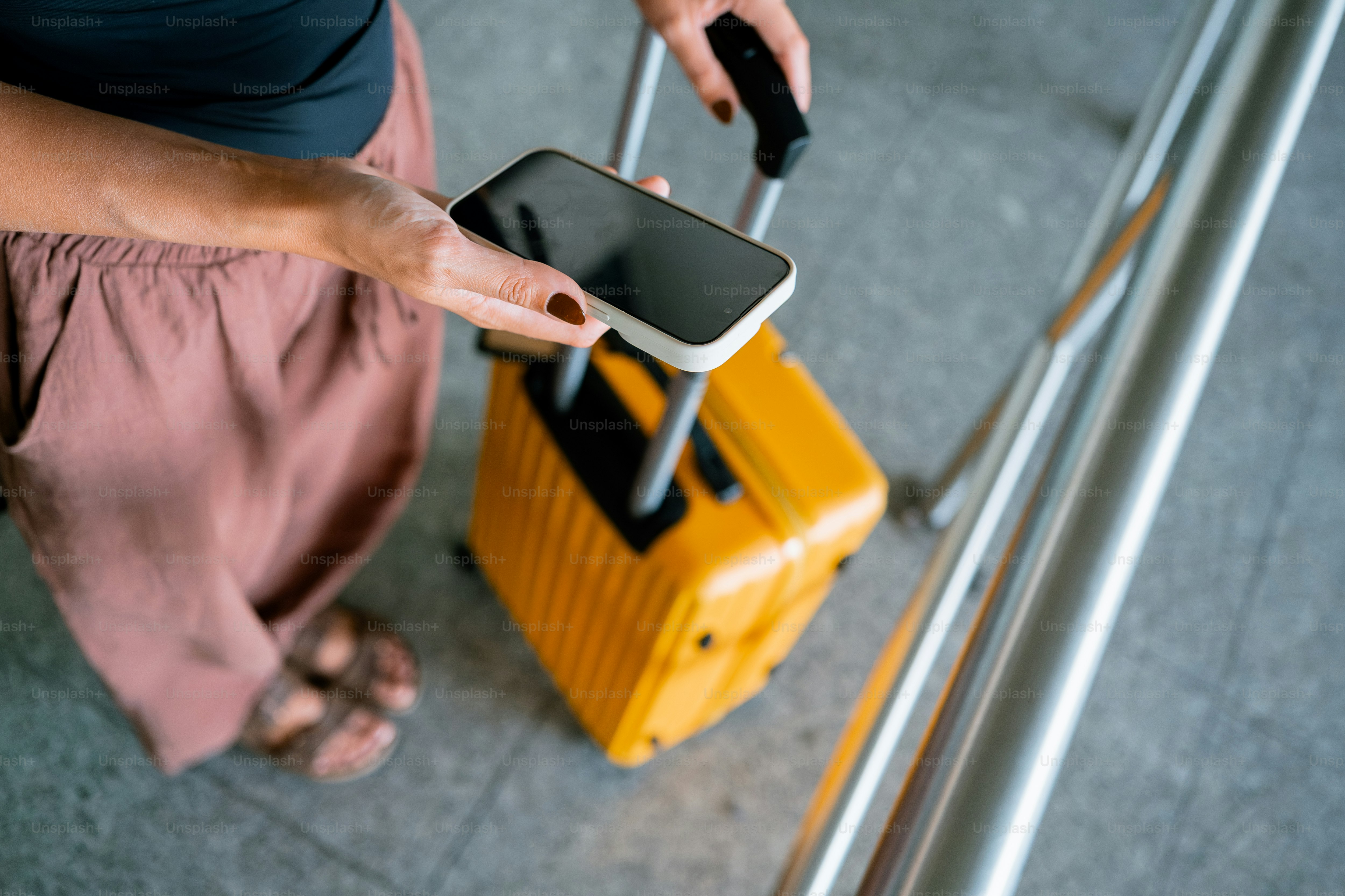 Person using a smartphone on a yellow device photo – Travel Image on ...