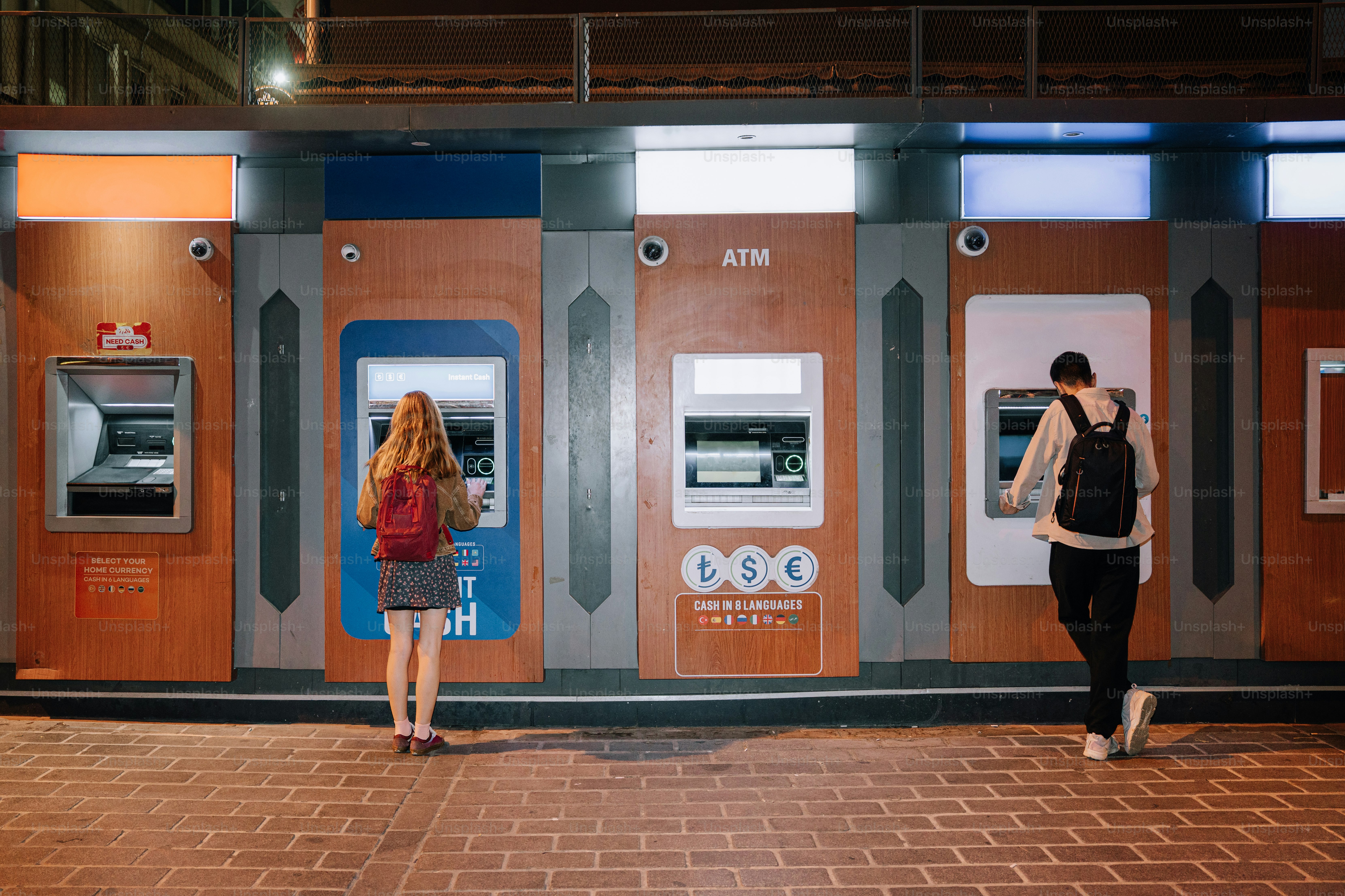 People using atms at night photo – Money Image on Unsplash
